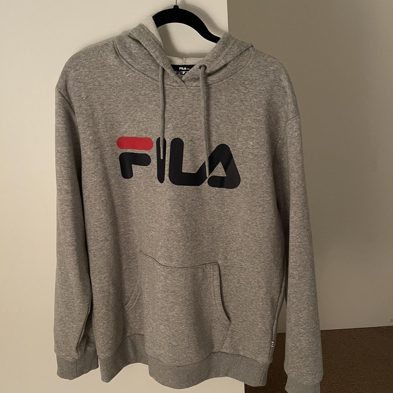 grey fila hoodie never worn size L - Depop