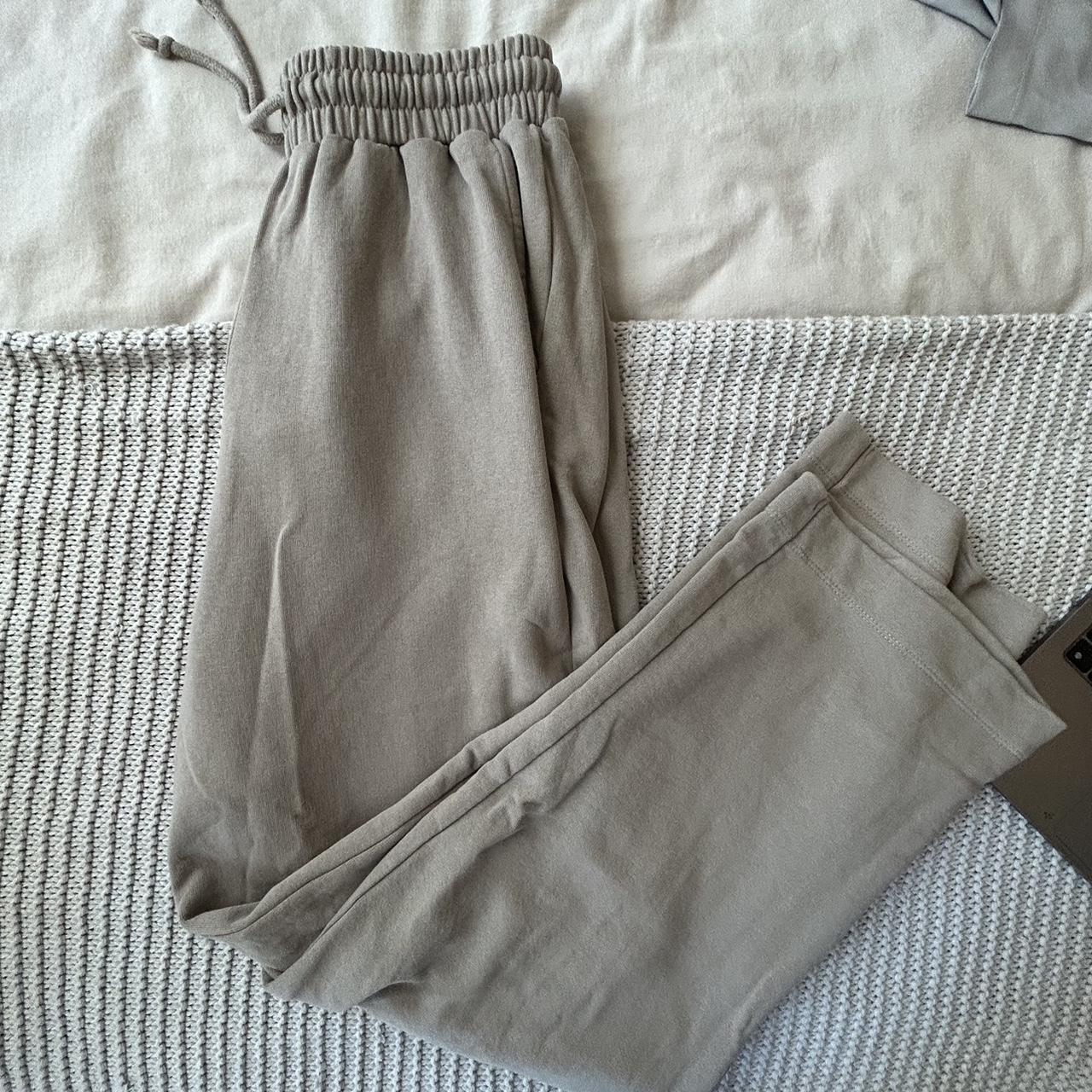 Comfy oversized grey trackies with straight line... - Depop