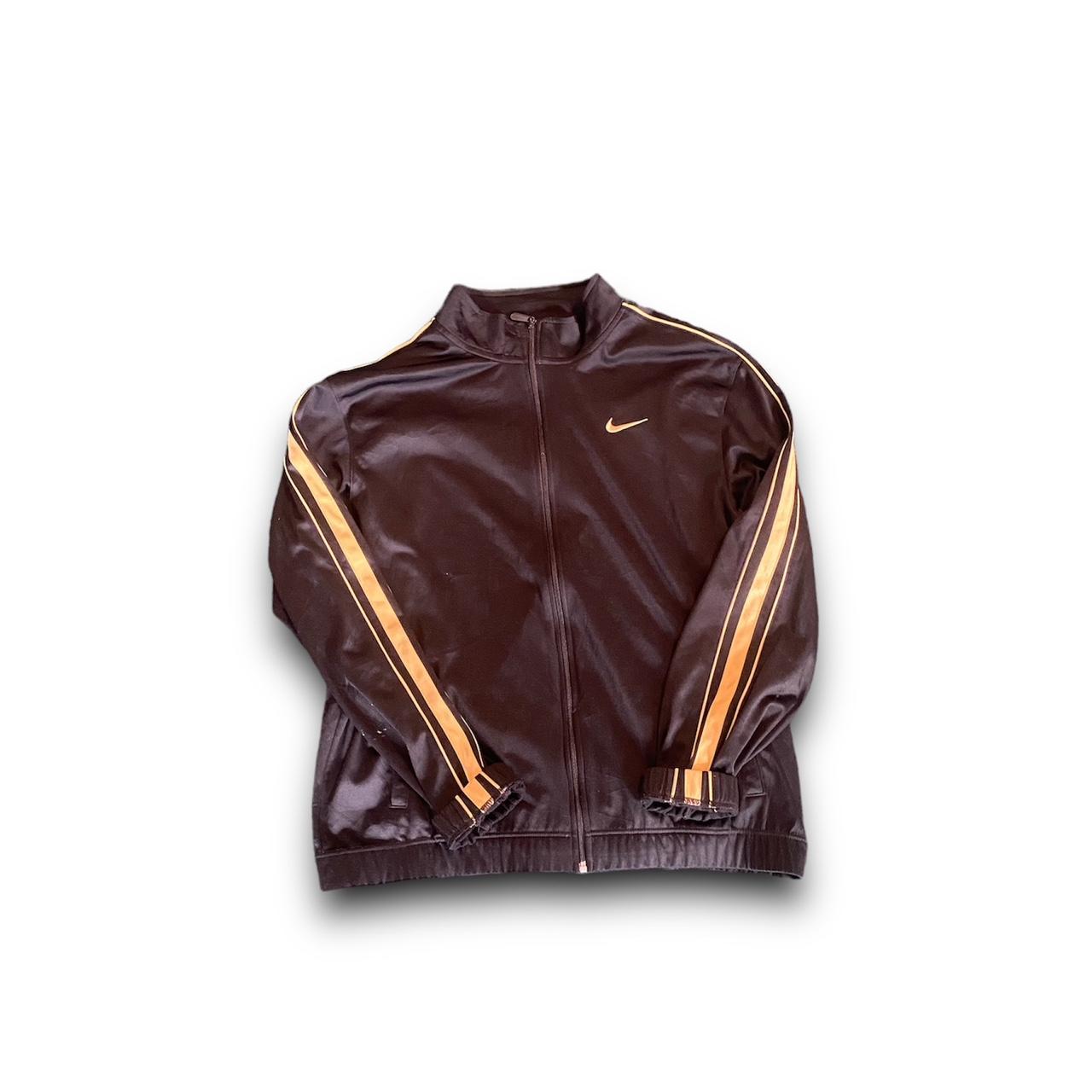 Perfect condition black and gold nike track jacket - Depop
