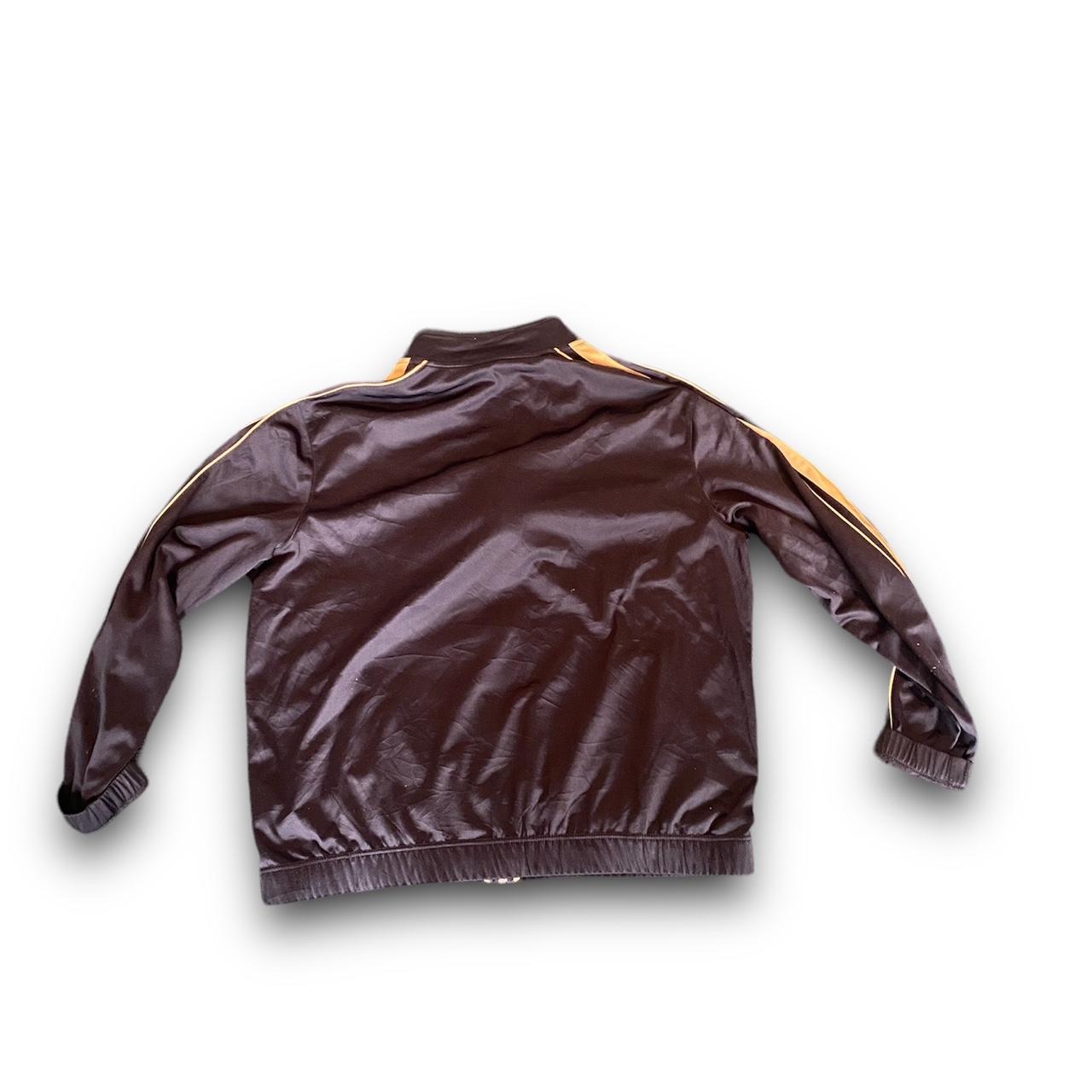 Perfect condition black and gold nike track jacket - Depop