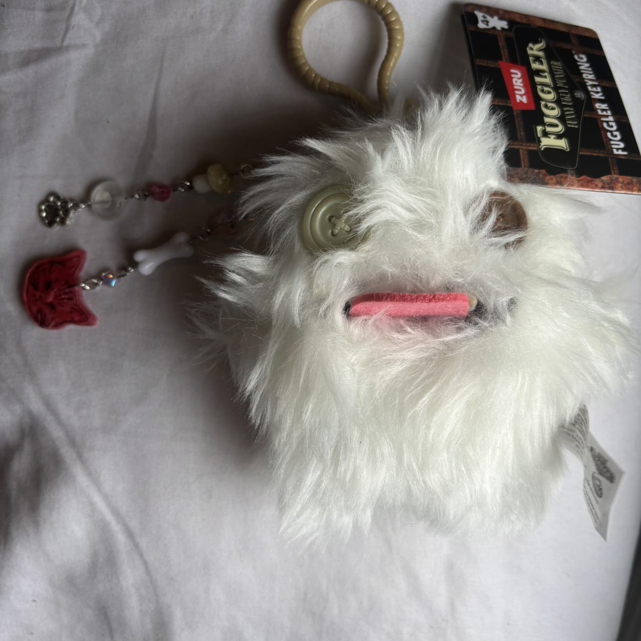 fuzzy white fuggler keychain with mostly glass bead... | Depop