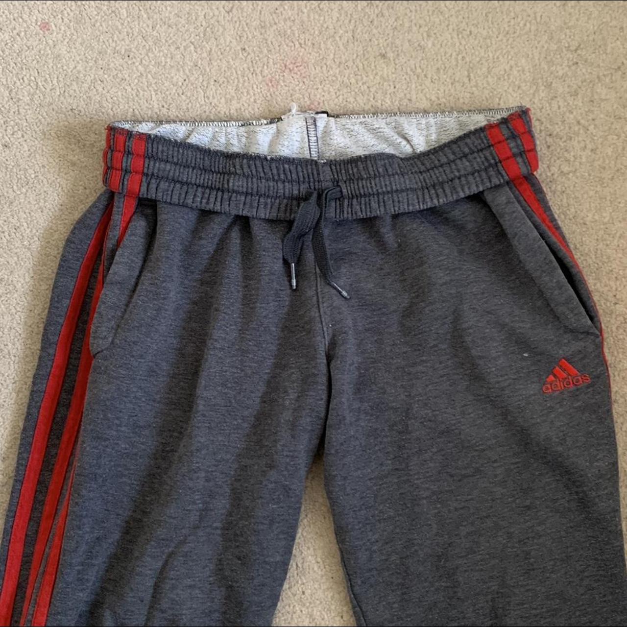 low rise adidas cuffed trackies with three red... - Depop