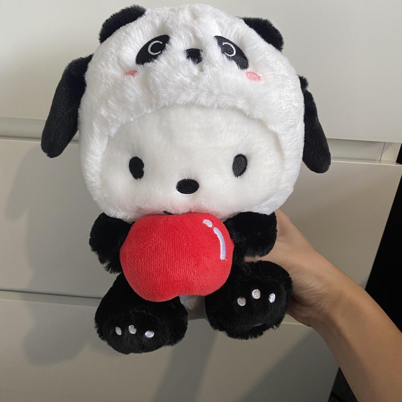 Sanrio Pochacco in a panda suit holding an apple... - Depop