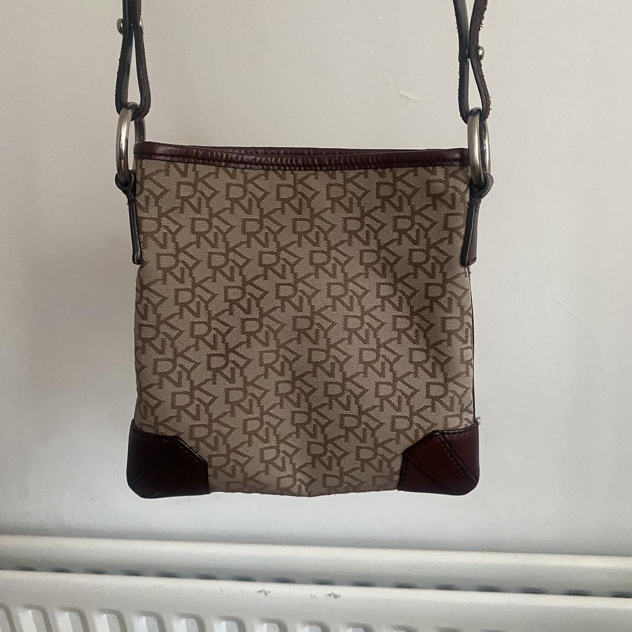 DKNY cross body bag with leather strap and monogram... - Depop