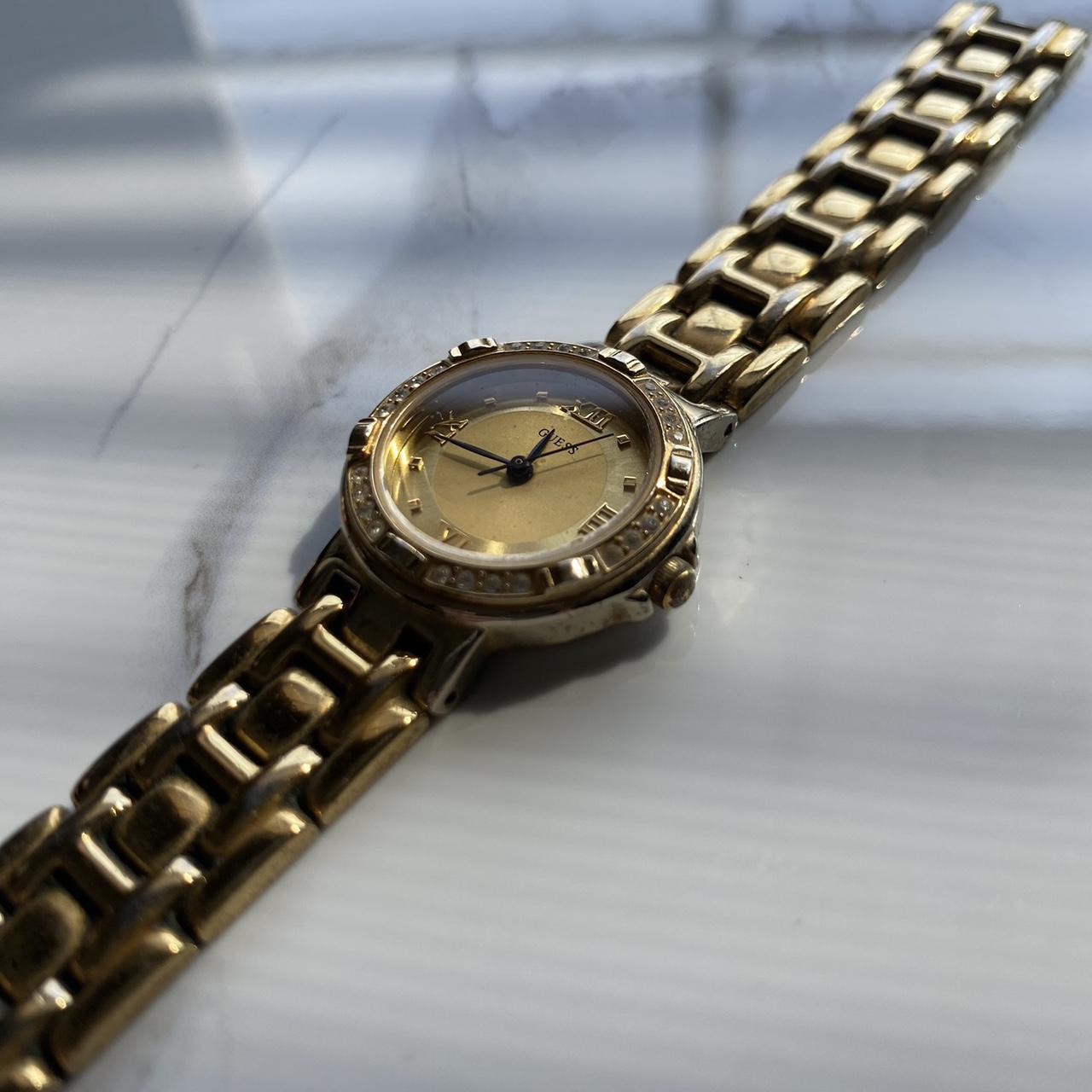 Gold Guess watch, has adjustable band. It has an... - Depop
