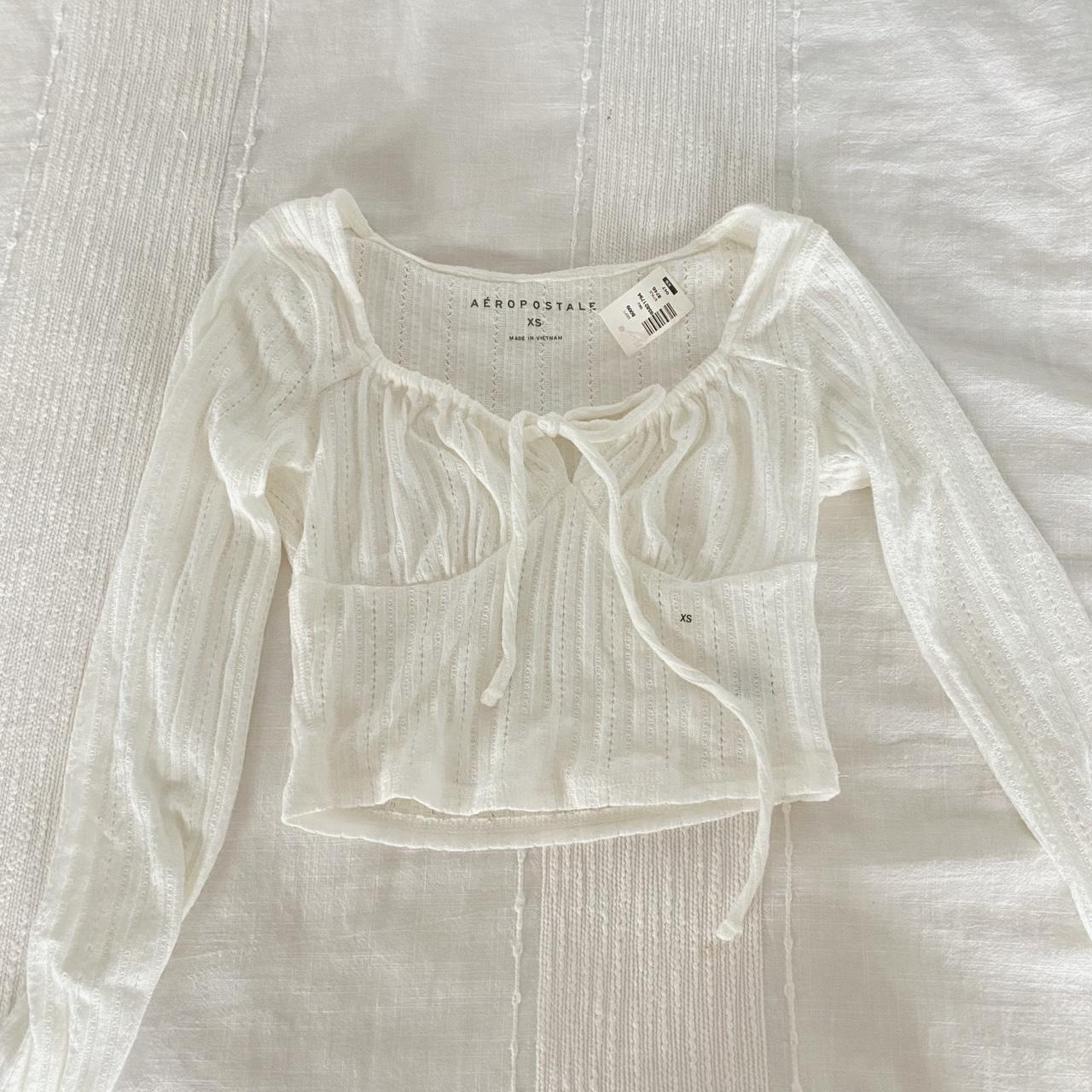 White cropped long sleeve with a tie middle from... - Depop