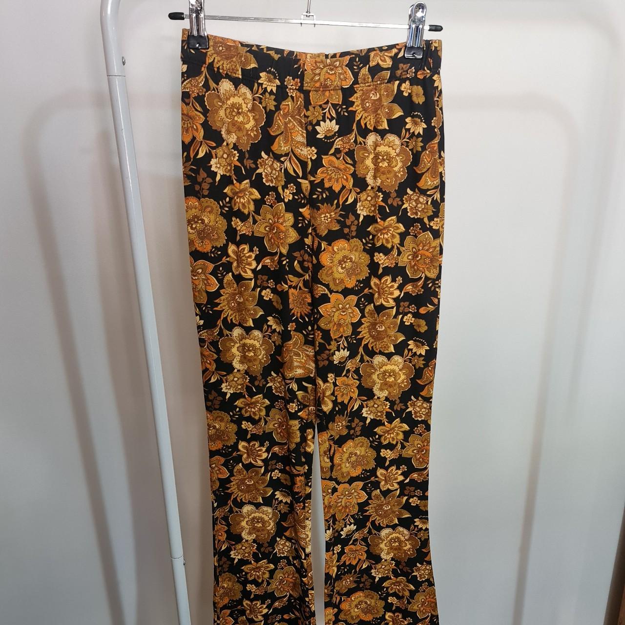 Floral flares Ghanda Flare pants stretchy Size 6... - Depop