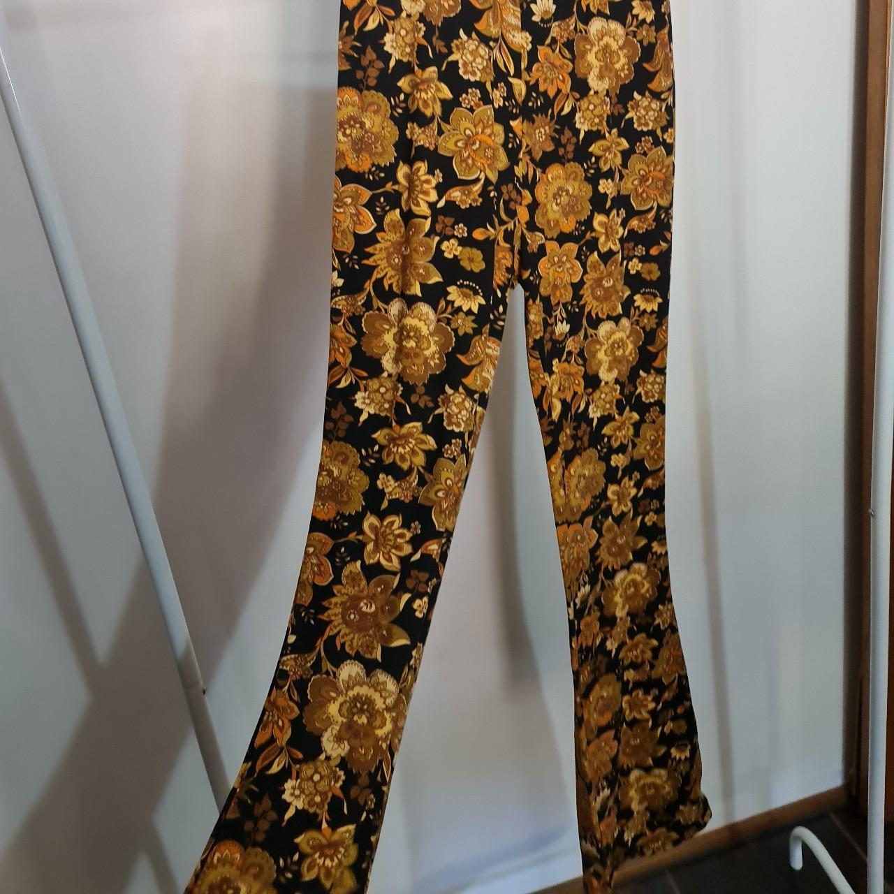 Floral flares Ghanda Flare pants stretchy Size 6... - Depop