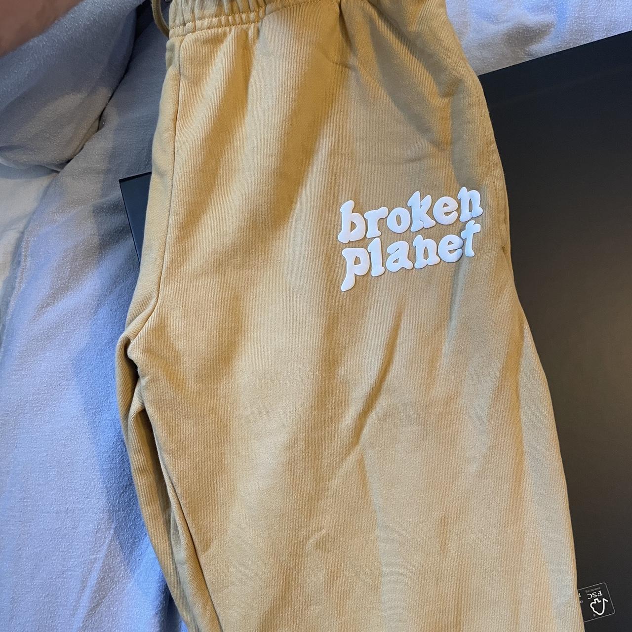 Broken Planet Yellow Flared Bottoms. - Depop