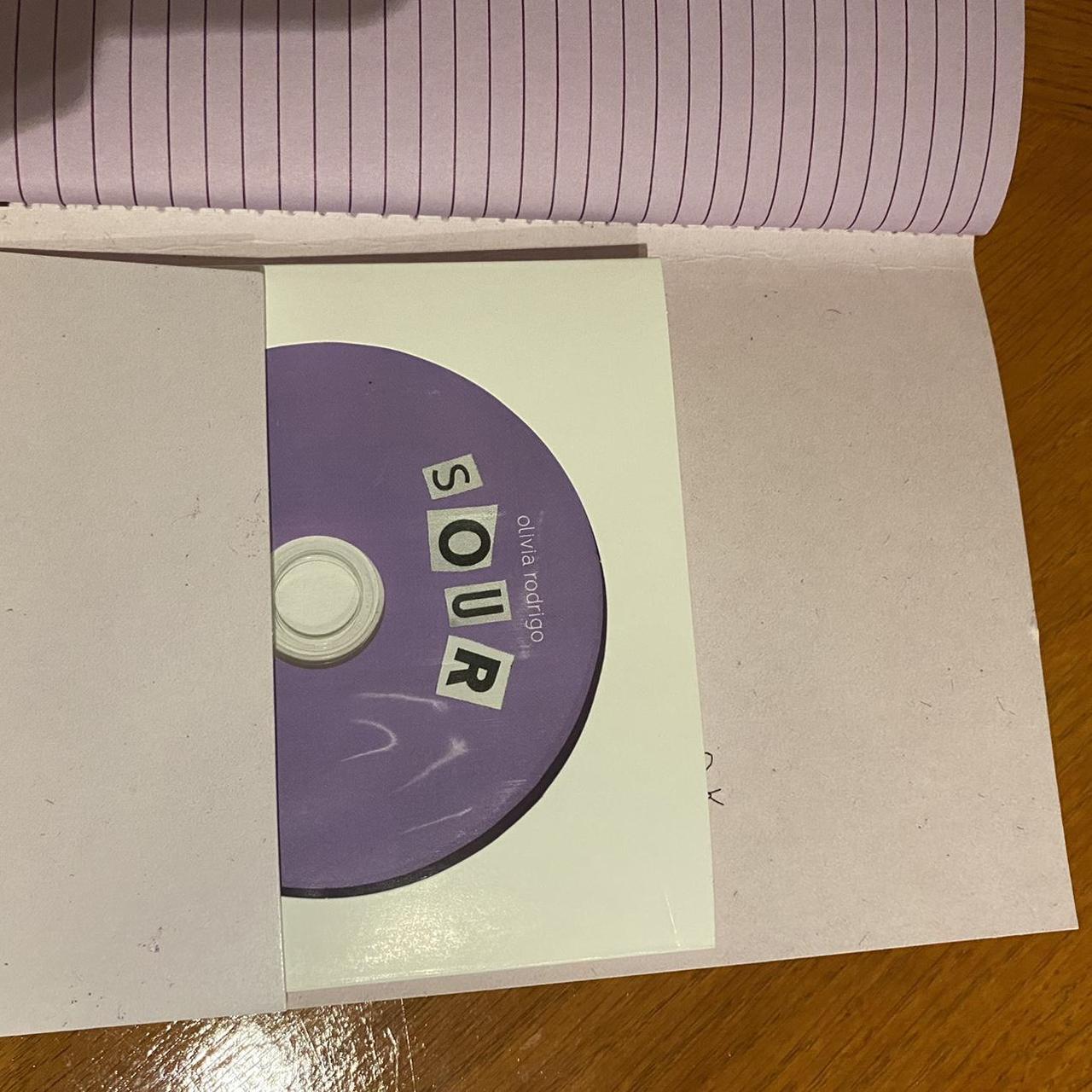 Olivia Rodrigo Sour book with cd! pls pay with... - Depop