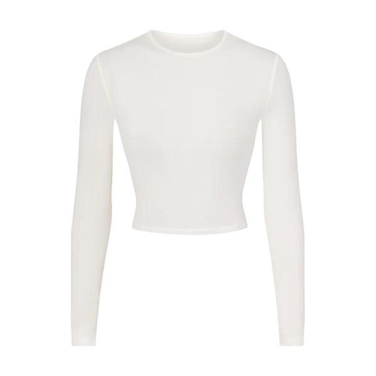 Skims cotton jersey cropped long sleeve top in bone... - Depop