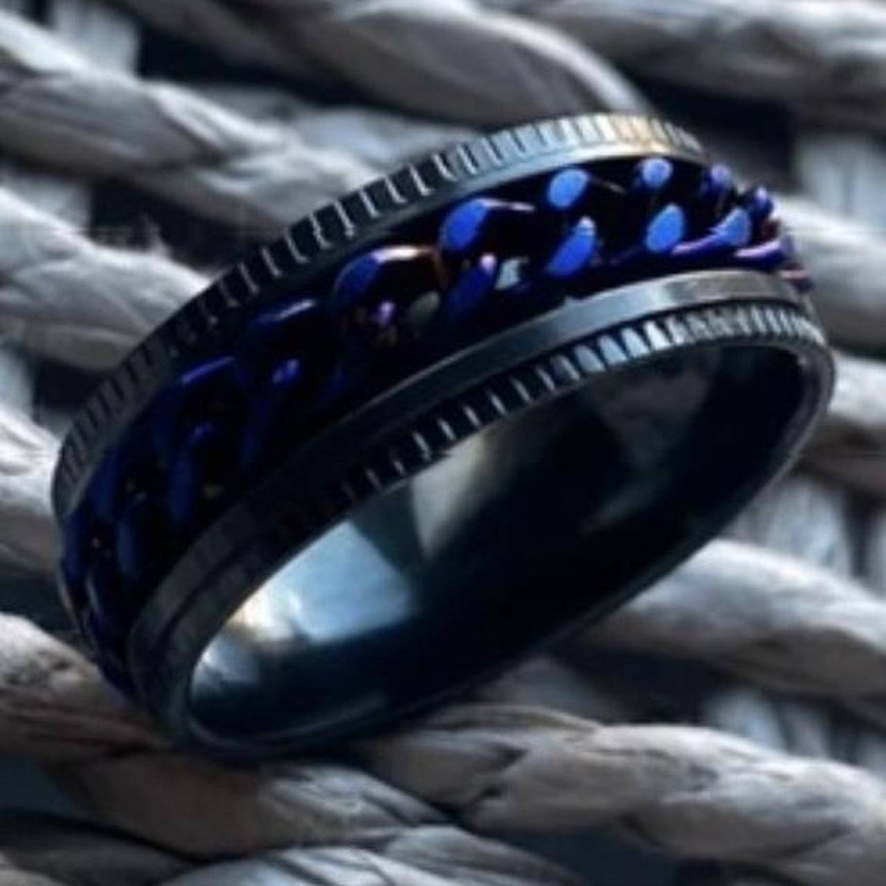 Black and blue stainless steel rotating chain ring... - Depop