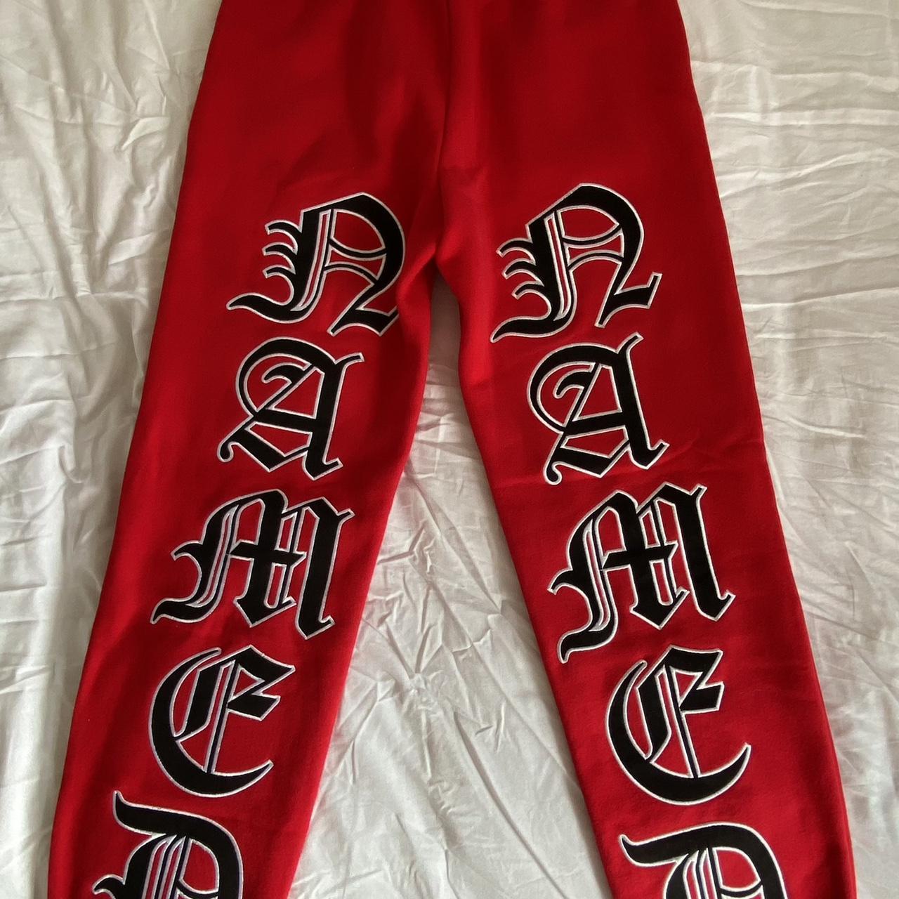Red named collective mission joggers - Depop
