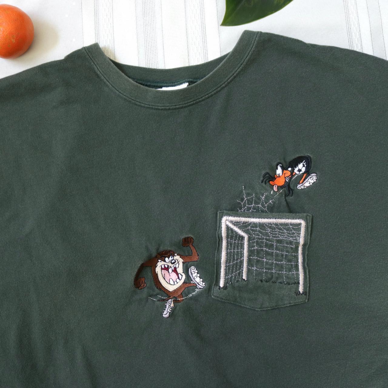 Green Taz and Daffy Duck soccer t-shirt. The soccer... | Depop