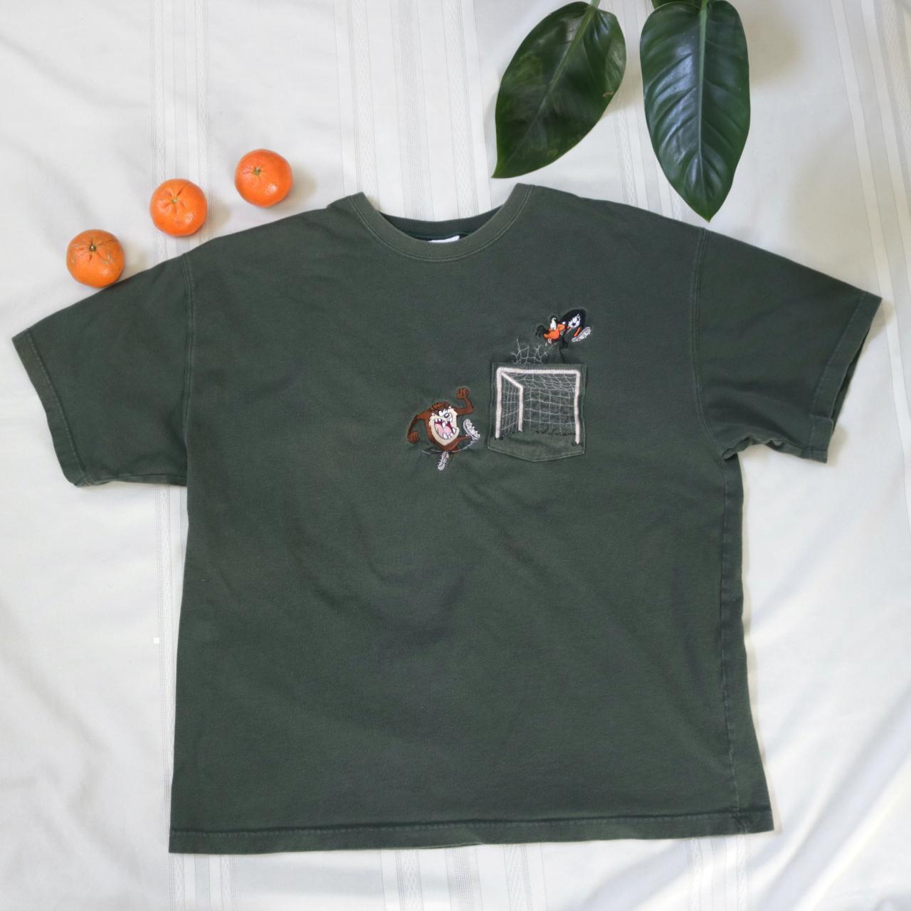 Green Taz and Daffy Duck soccer t-shirt. The soccer... | Depop