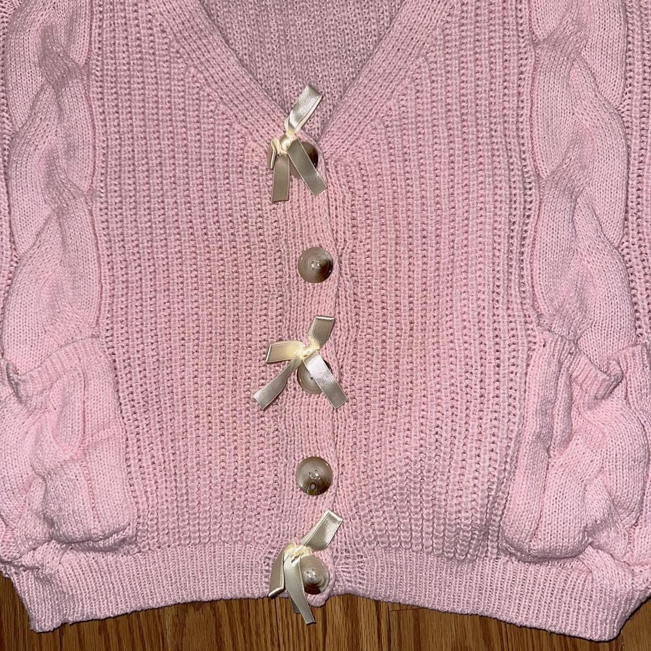 Pink coquette cardigan. Cardigan has bow and pockets... - Depop