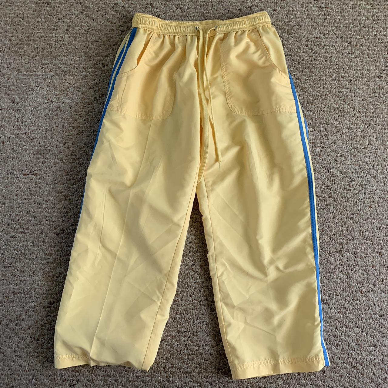 Yellow capri track pants. Super cute blue stripe... - Depop