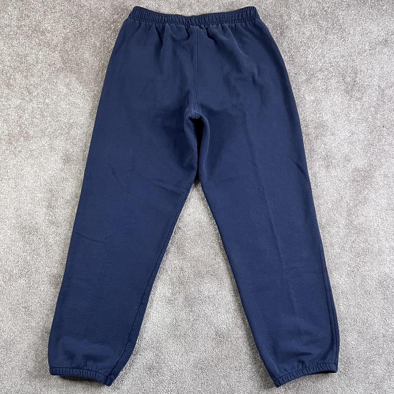 Vintage Champion cuffed sweatpants in navy. Men's... - Depop