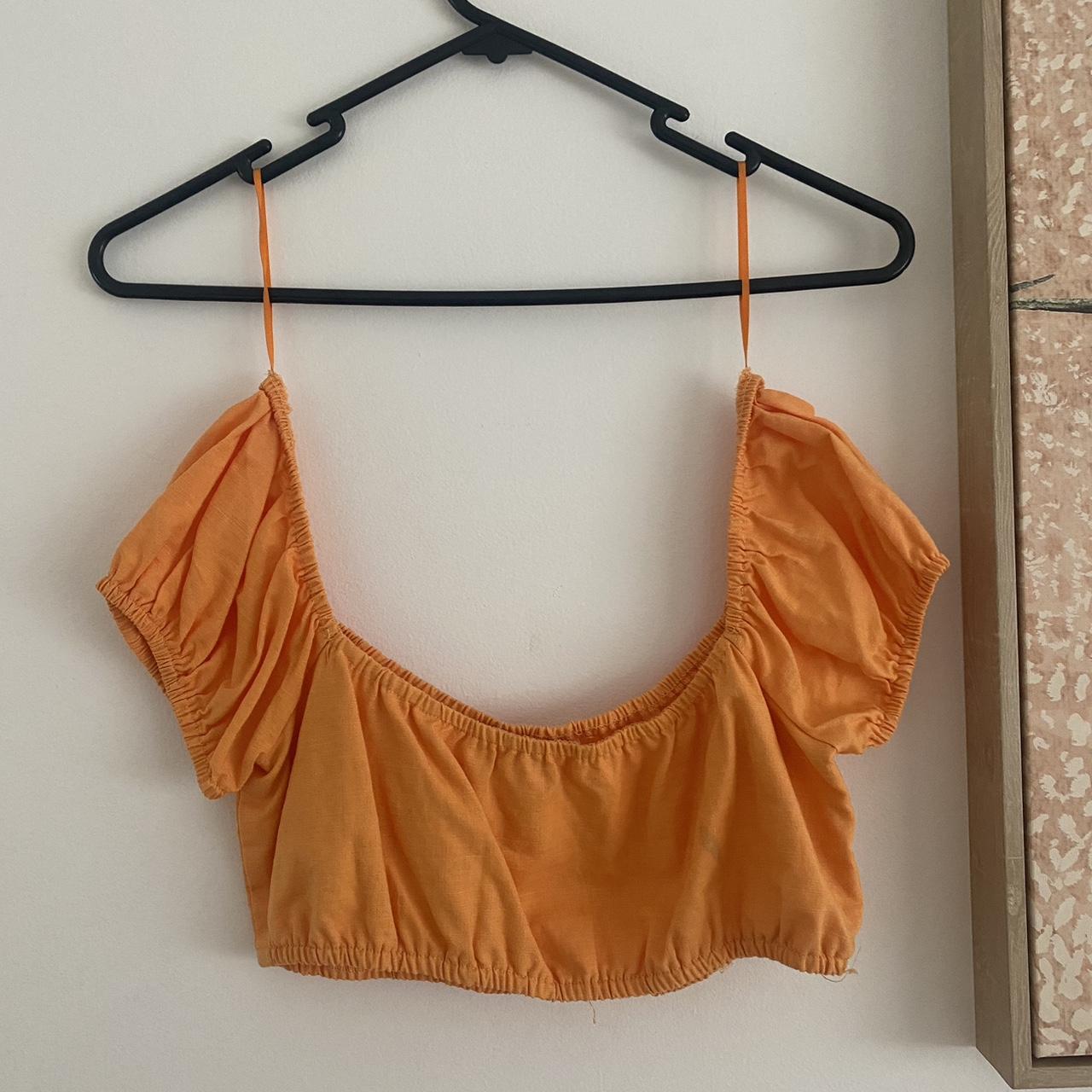 Subtitled orange crop top, size 6