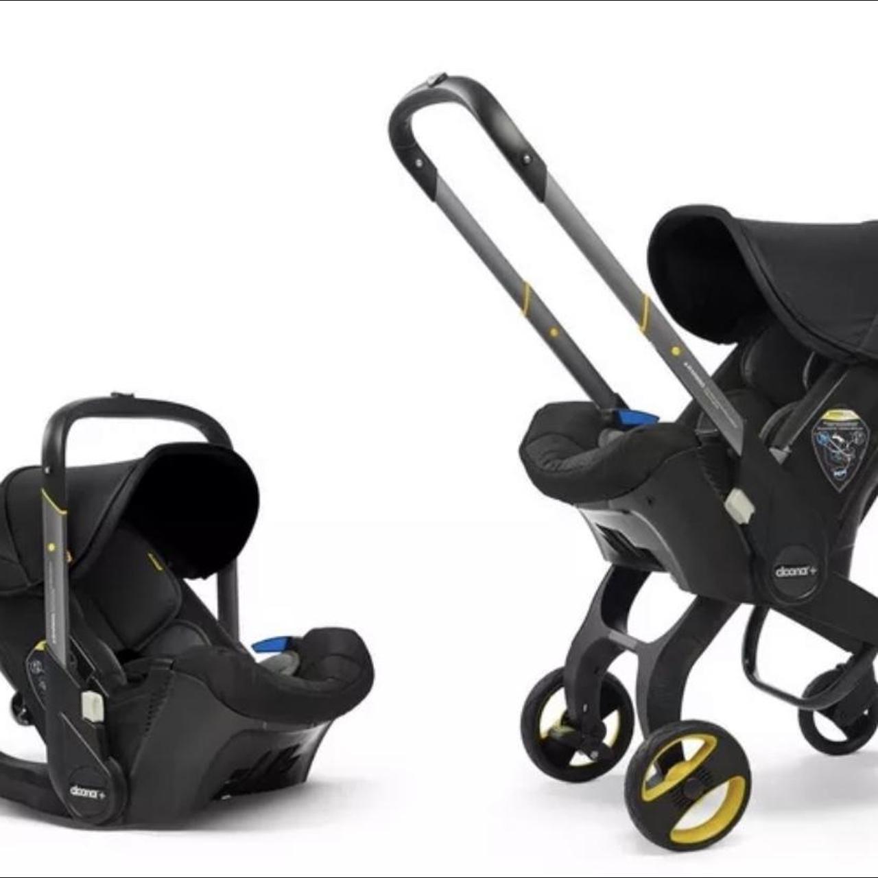 Black Doona pram used comes with rain cover. Perfect... - Depop