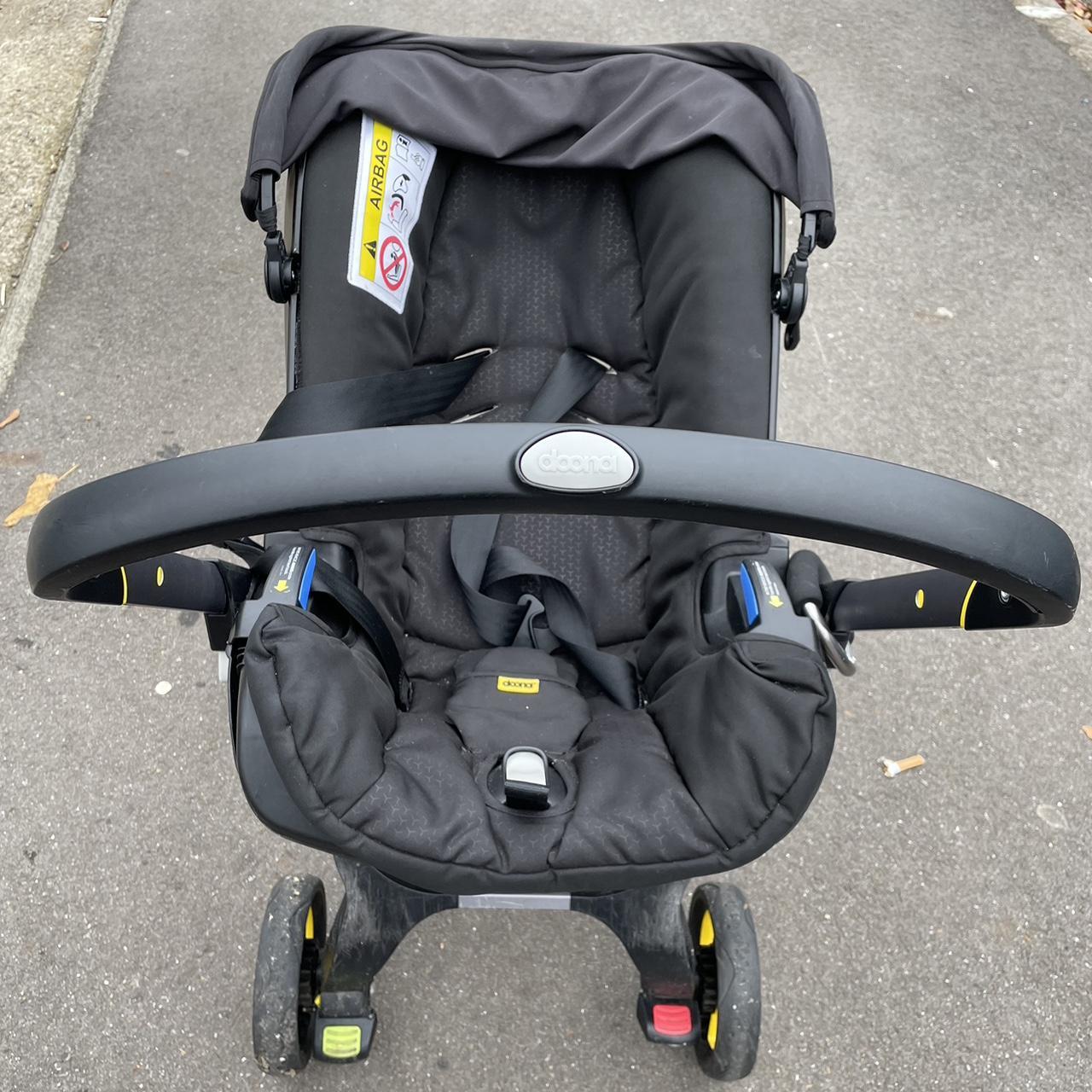 Black Doona pram used comes with rain cover. Perfect... - Depop