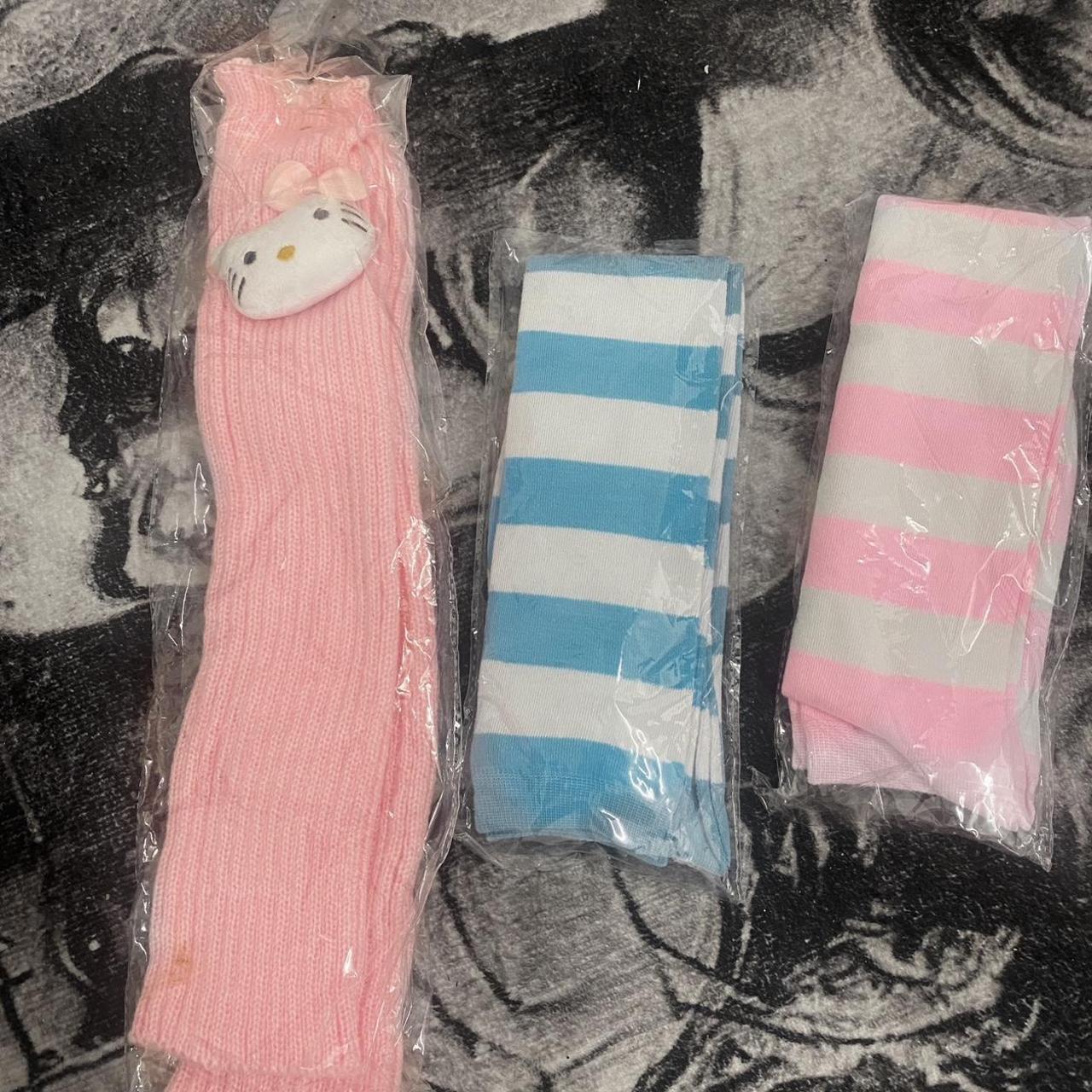 Hello kitty leg warmers and striped thigh highs... - Depop