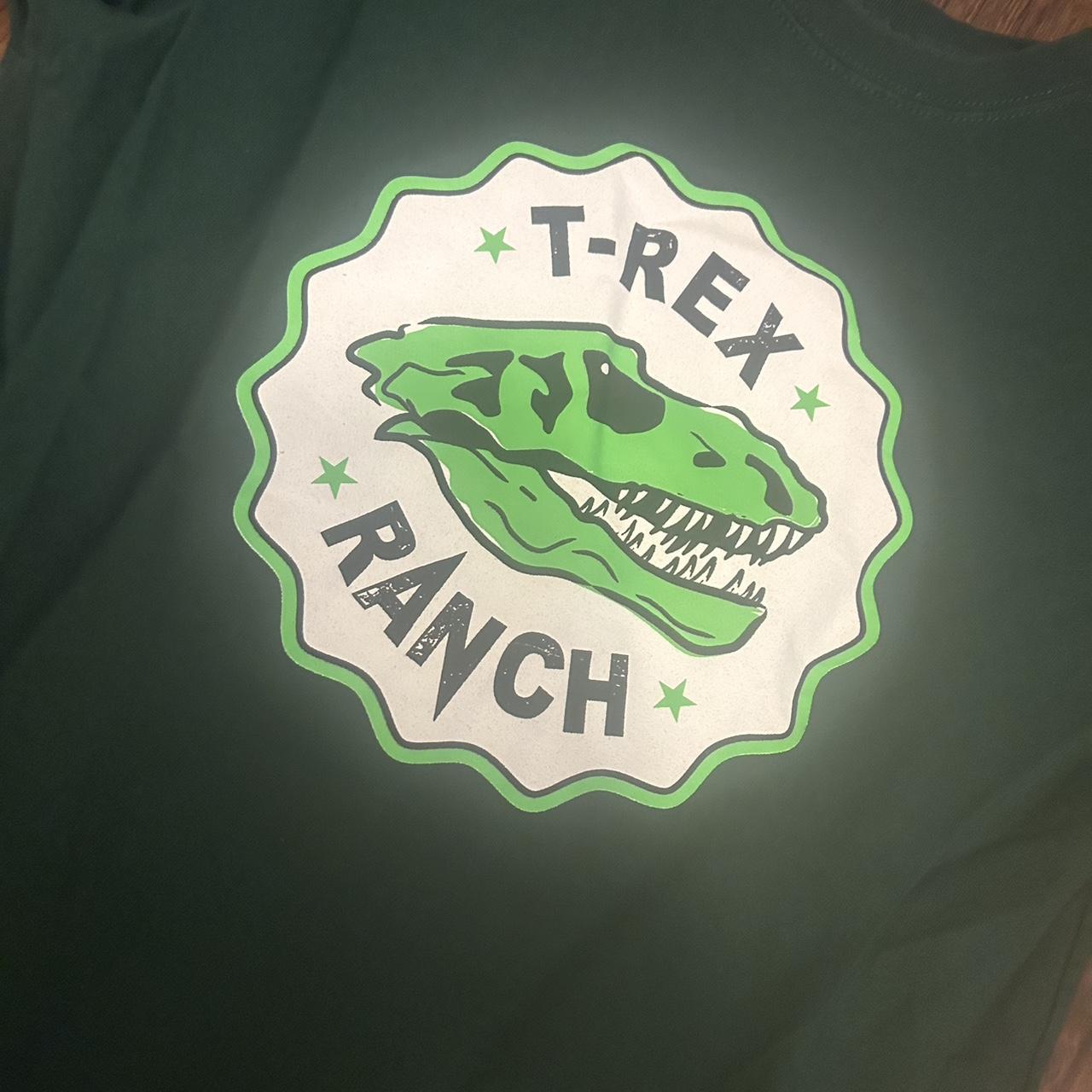 dark forest green T-rex Ranch graphic baby... - Depop