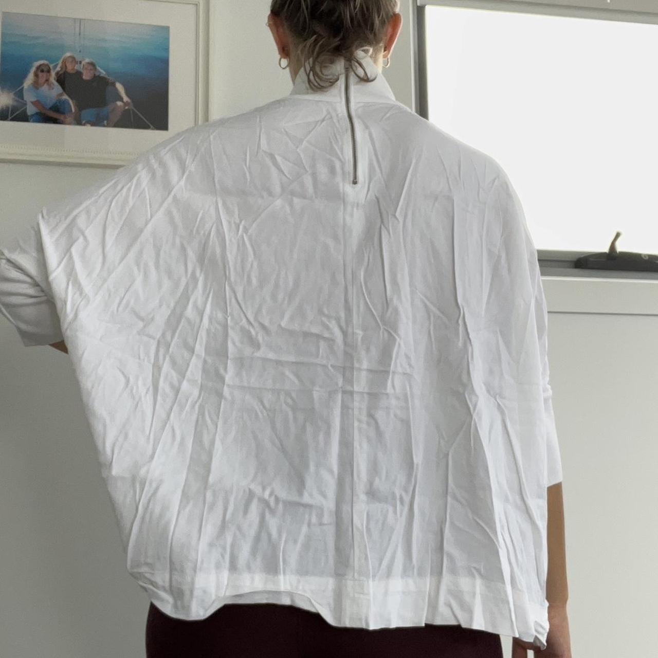 SABA bat winged top. White stretch fabric with high... - Depop