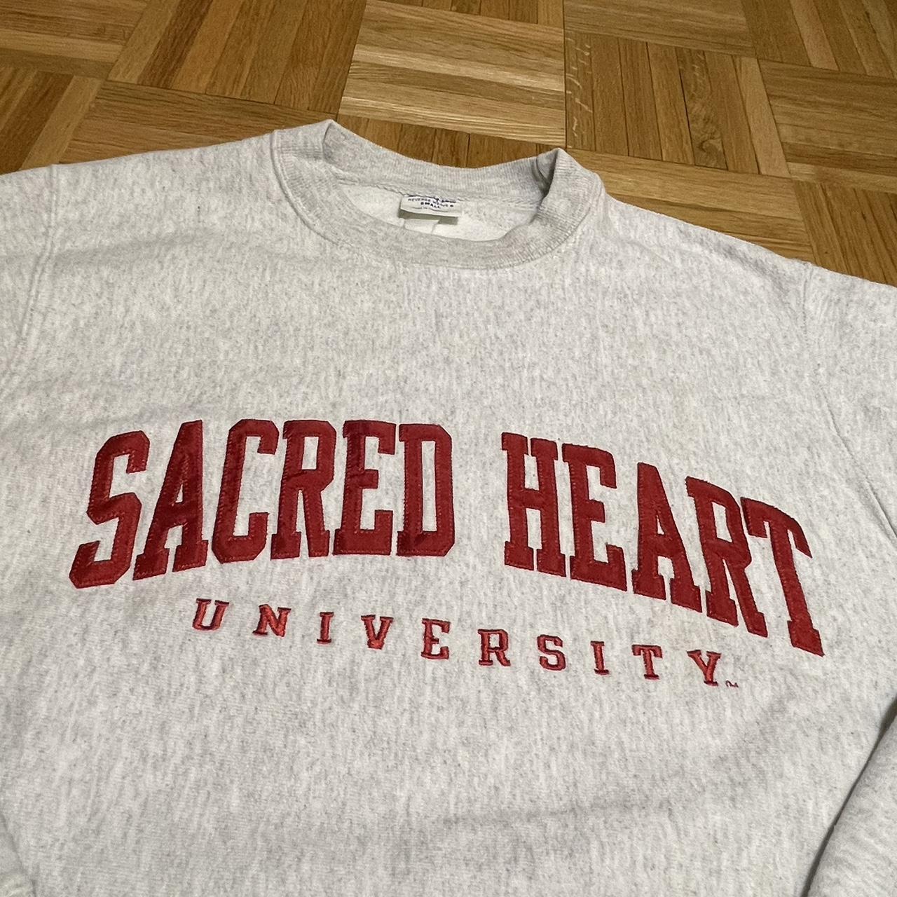 Champion reverse weave sacred heart university fully... - Depop