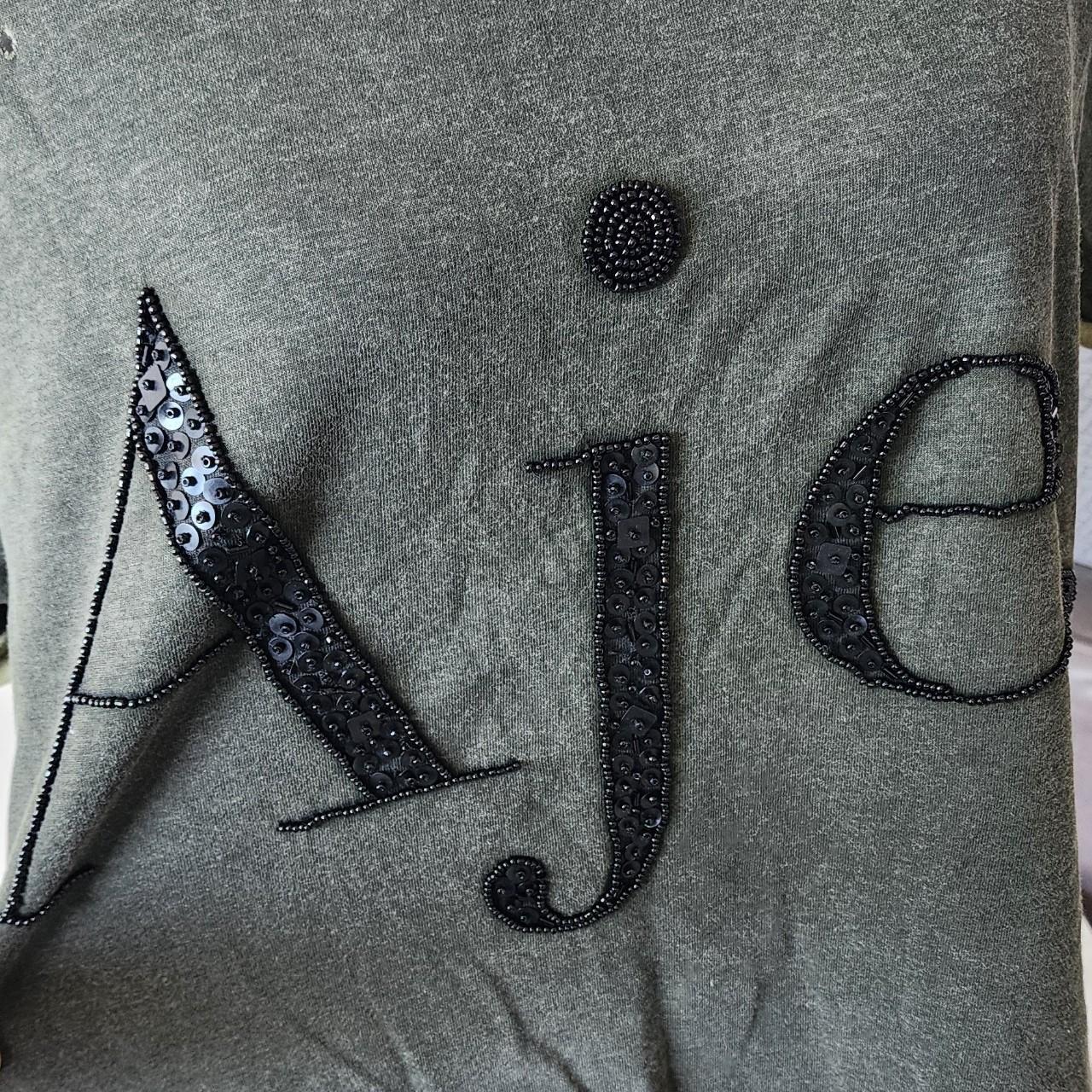 Aje distressed oversized t-shirt size xs with black... - Depop