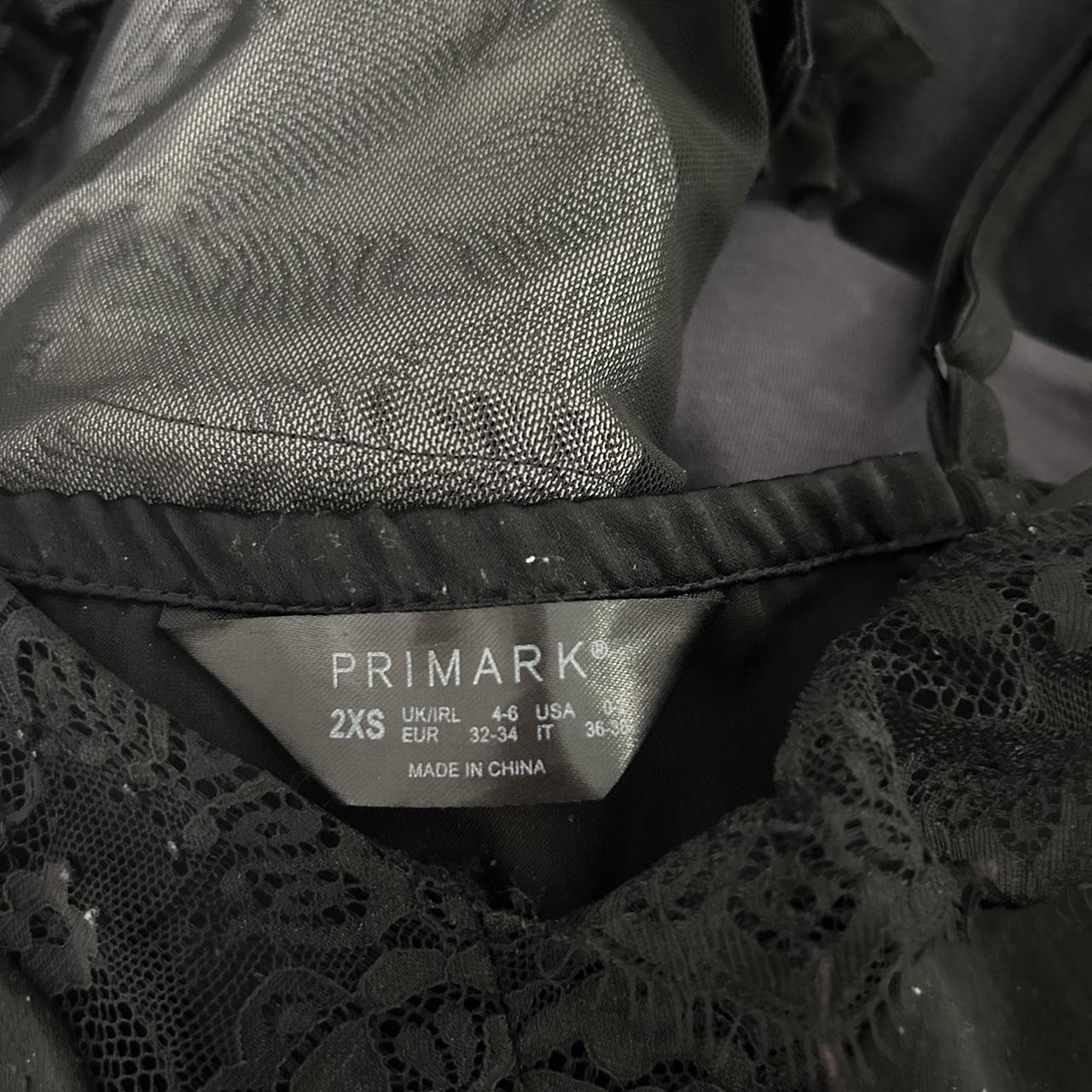 primark black top with lace along the v neck size... - Depop