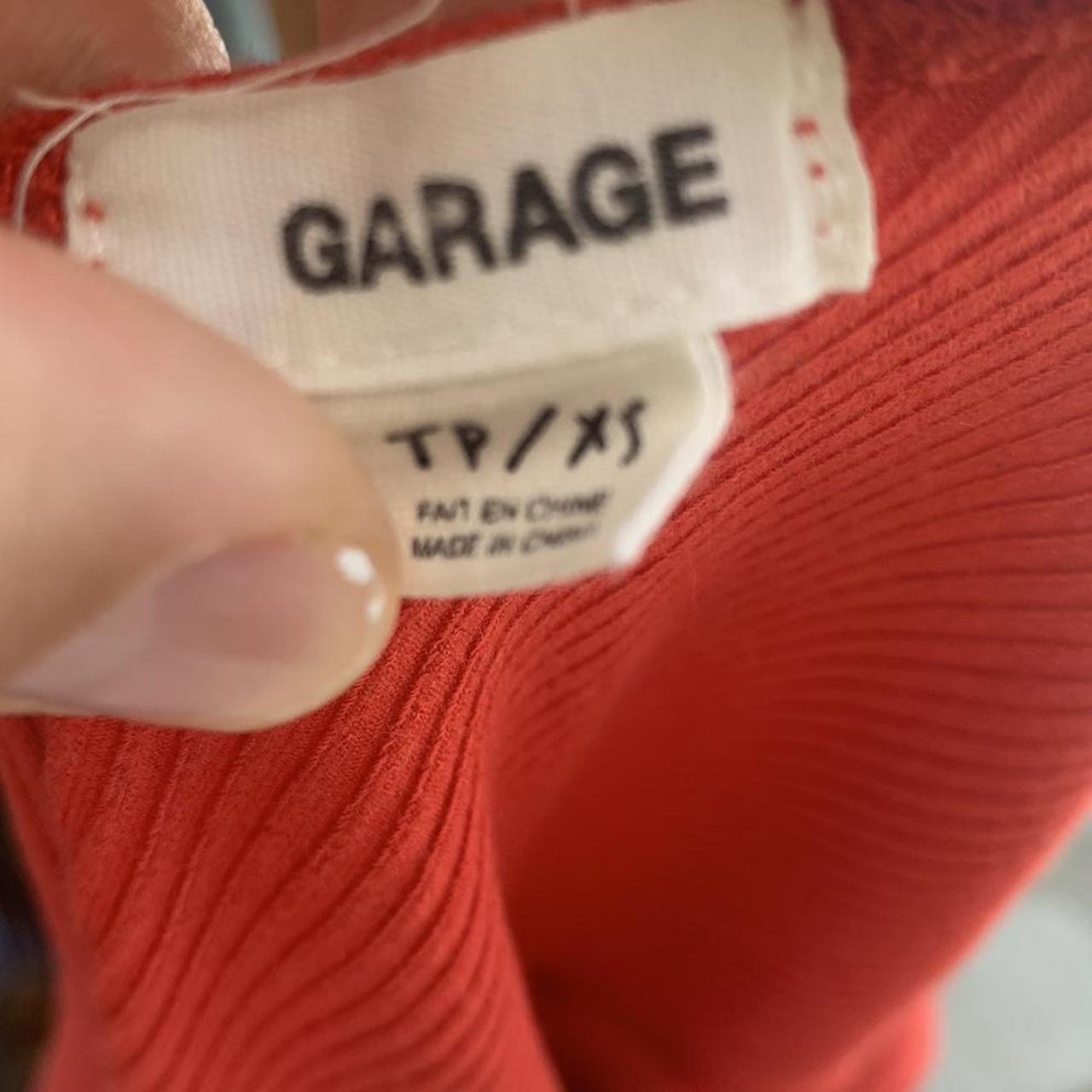 Garage brand Red ribbed tank top with a V neckline... | Depop