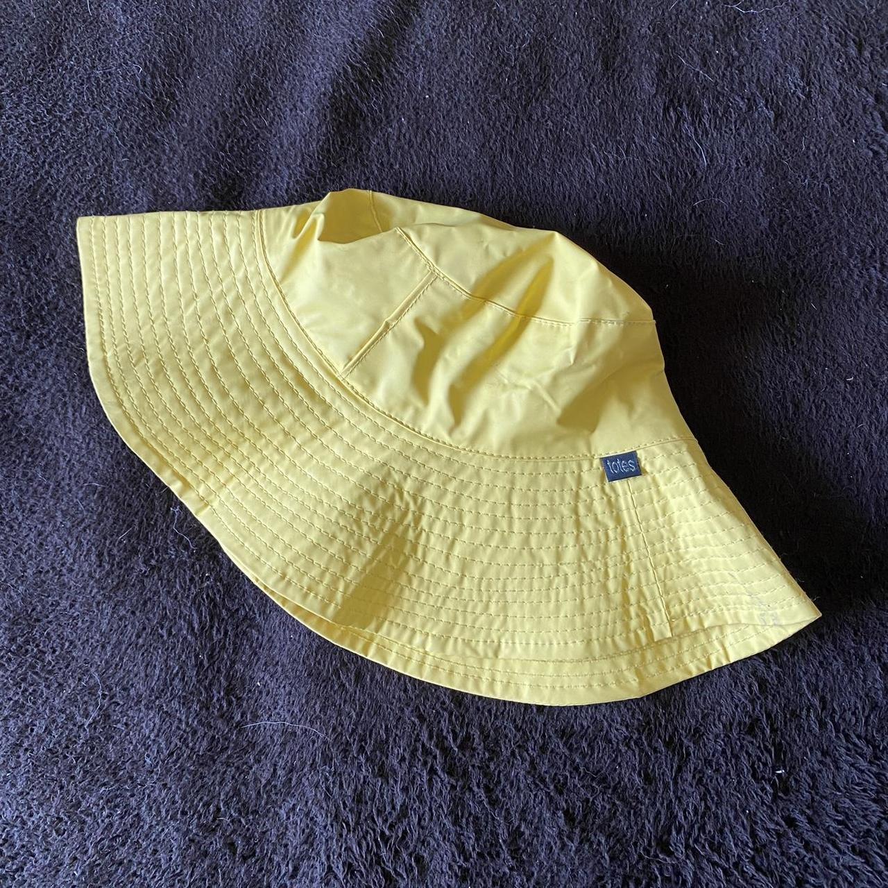 yellow waterproof totes bucket hat. only flaw is... - Depop