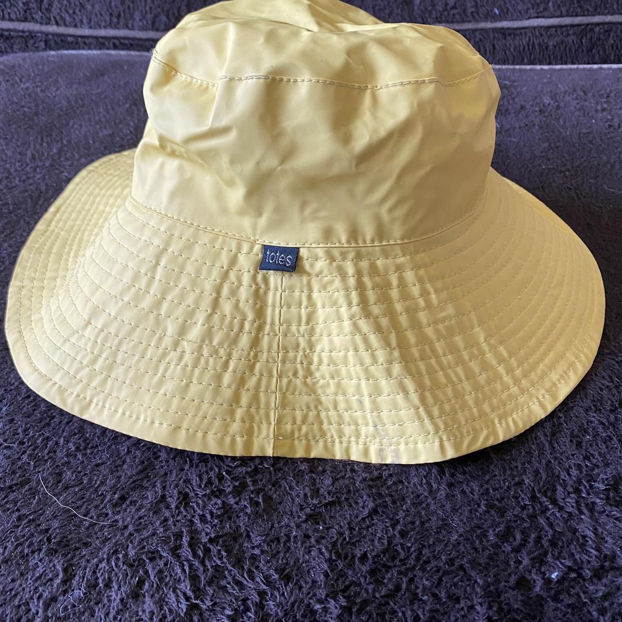 yellow waterproof totes bucket hat. only flaw is... - Depop