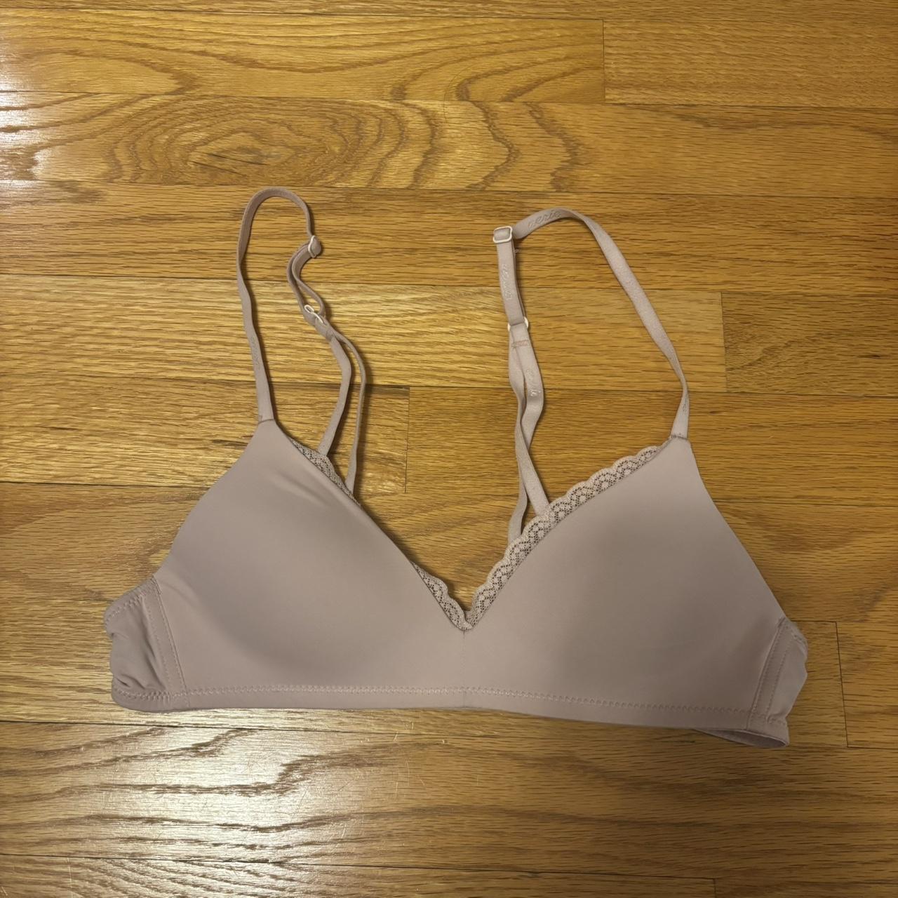 Baby pink unlined unwired bra with lace on the cups... | Depop