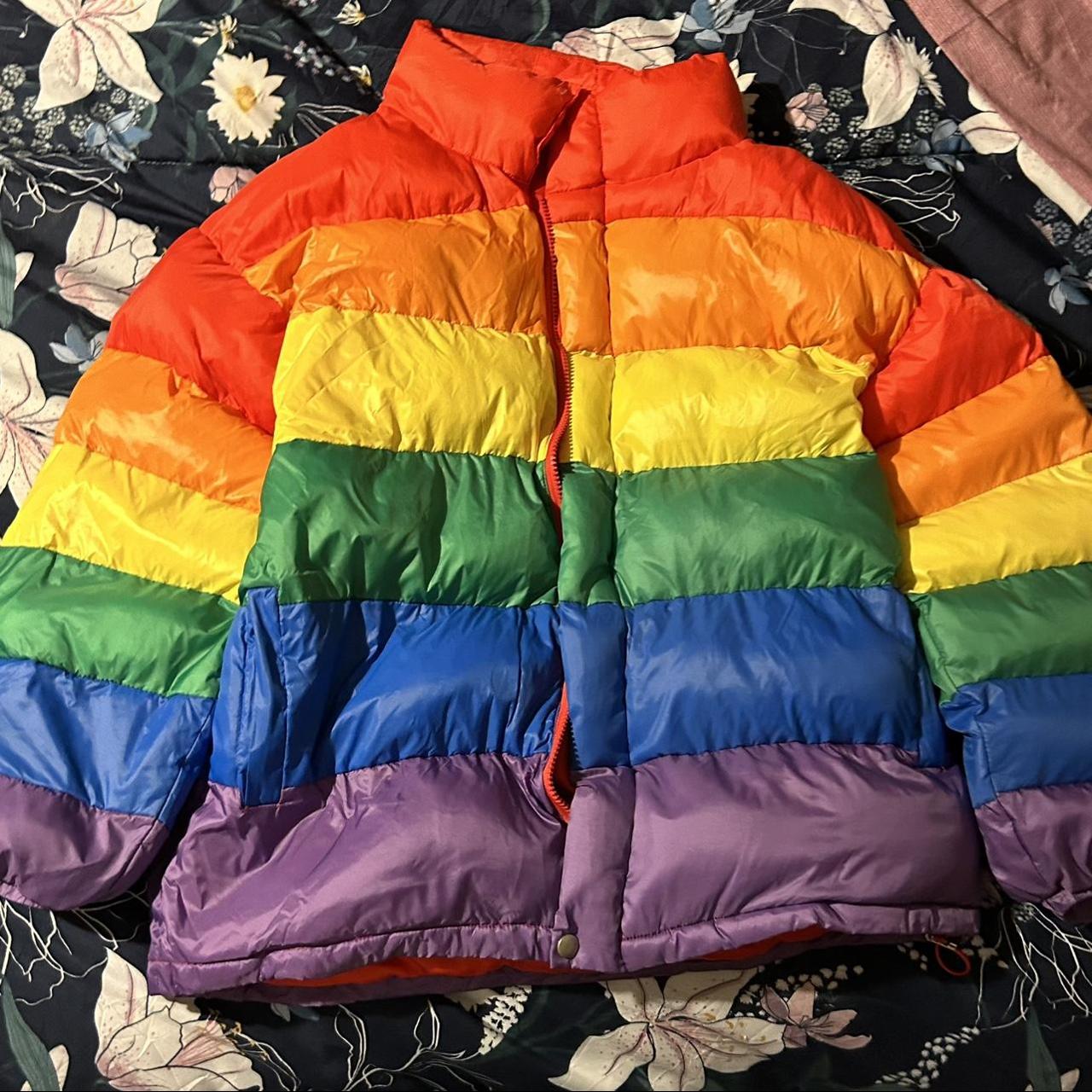 Rainbow winter jacket marked as size M very... - Depop