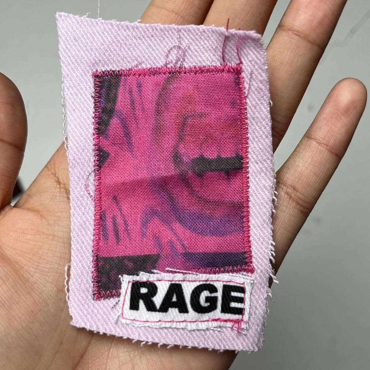 pink denim patch with text reading 'RAGE'🔪 made... - Depop
