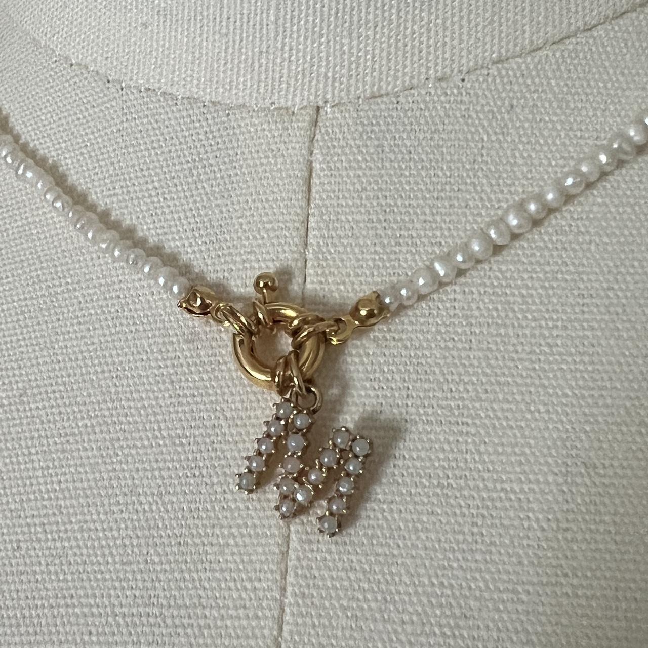 faux pearl necklace with M charm, front circular... - Depop