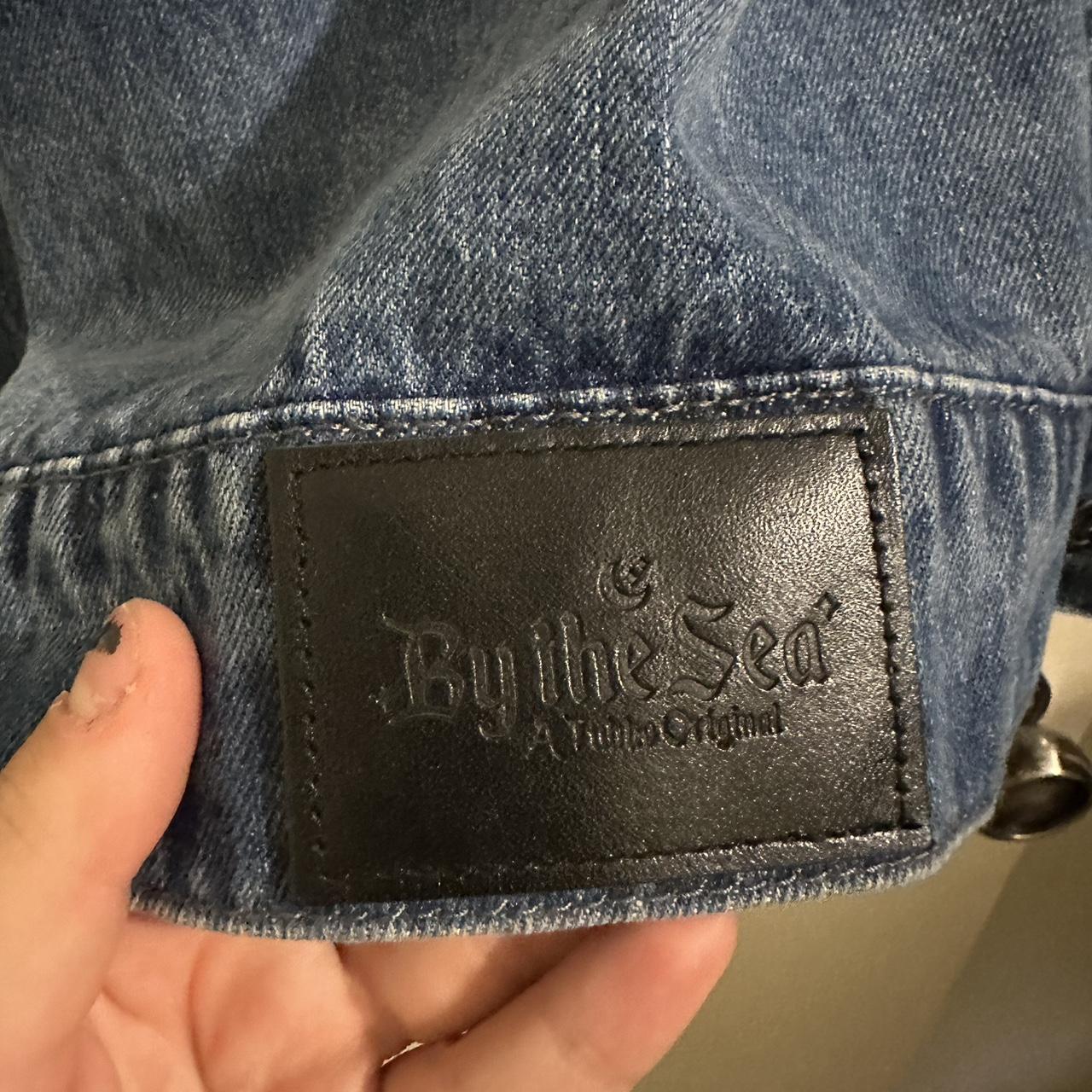 Oversized denim jacket with design on the back and a... - Depop