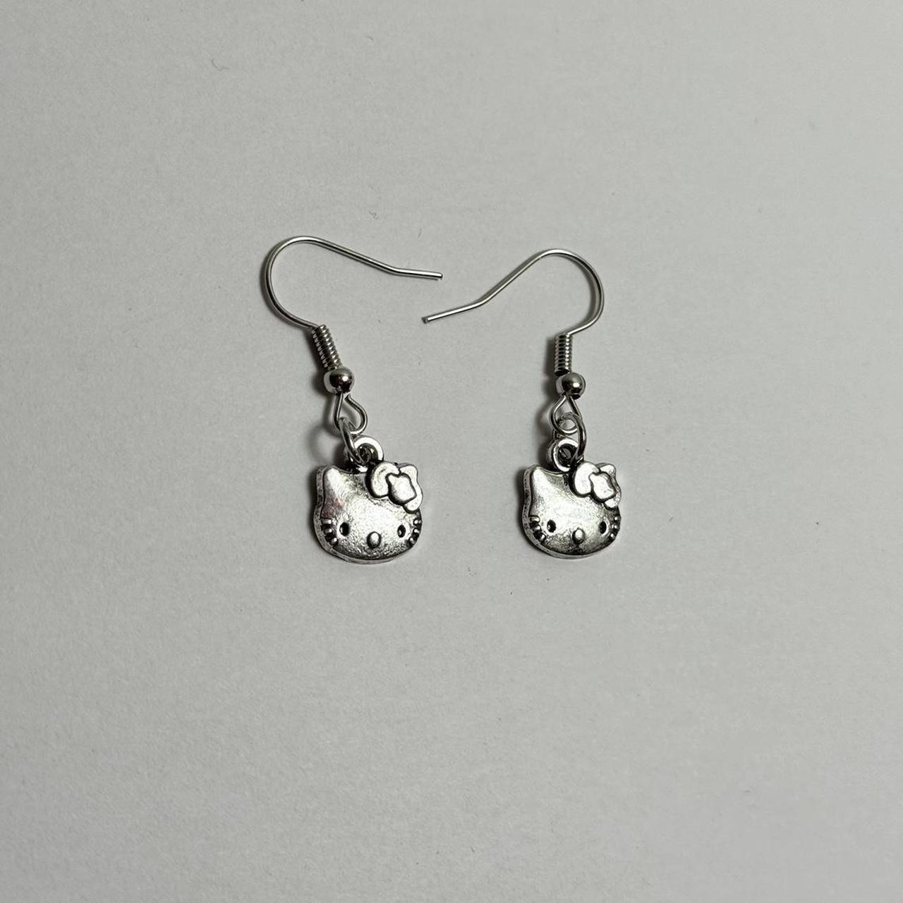 🐱🎀 Little silver Hello Kitty earrings BUY ONE GET... - Depop