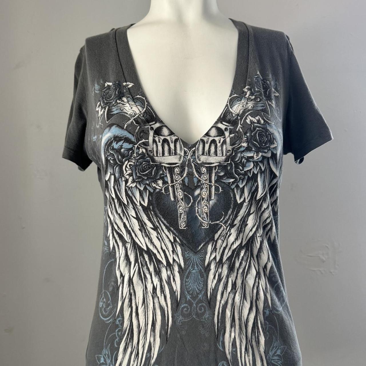 Trashy Cyber Y2k Gun With Wings BRAD BUTTER V-Neck... - Depop