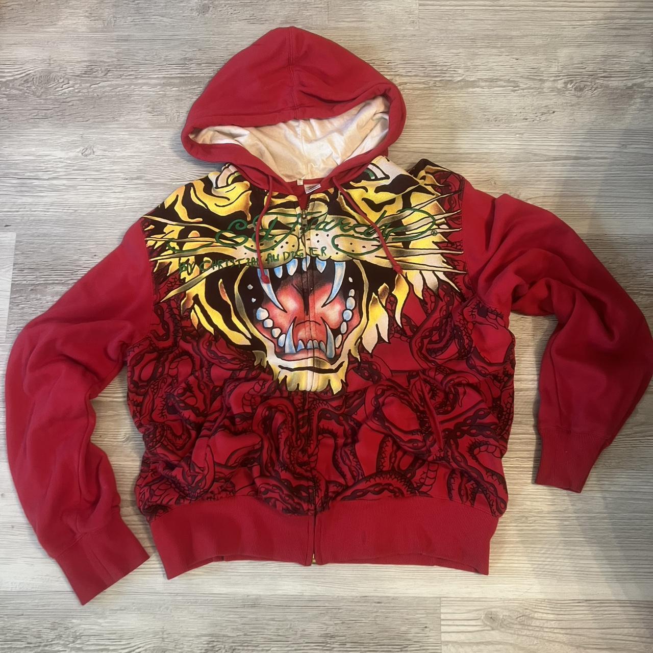 Red Ed Hardy zip up hoodie Minor wear, mostly in the... | Depop