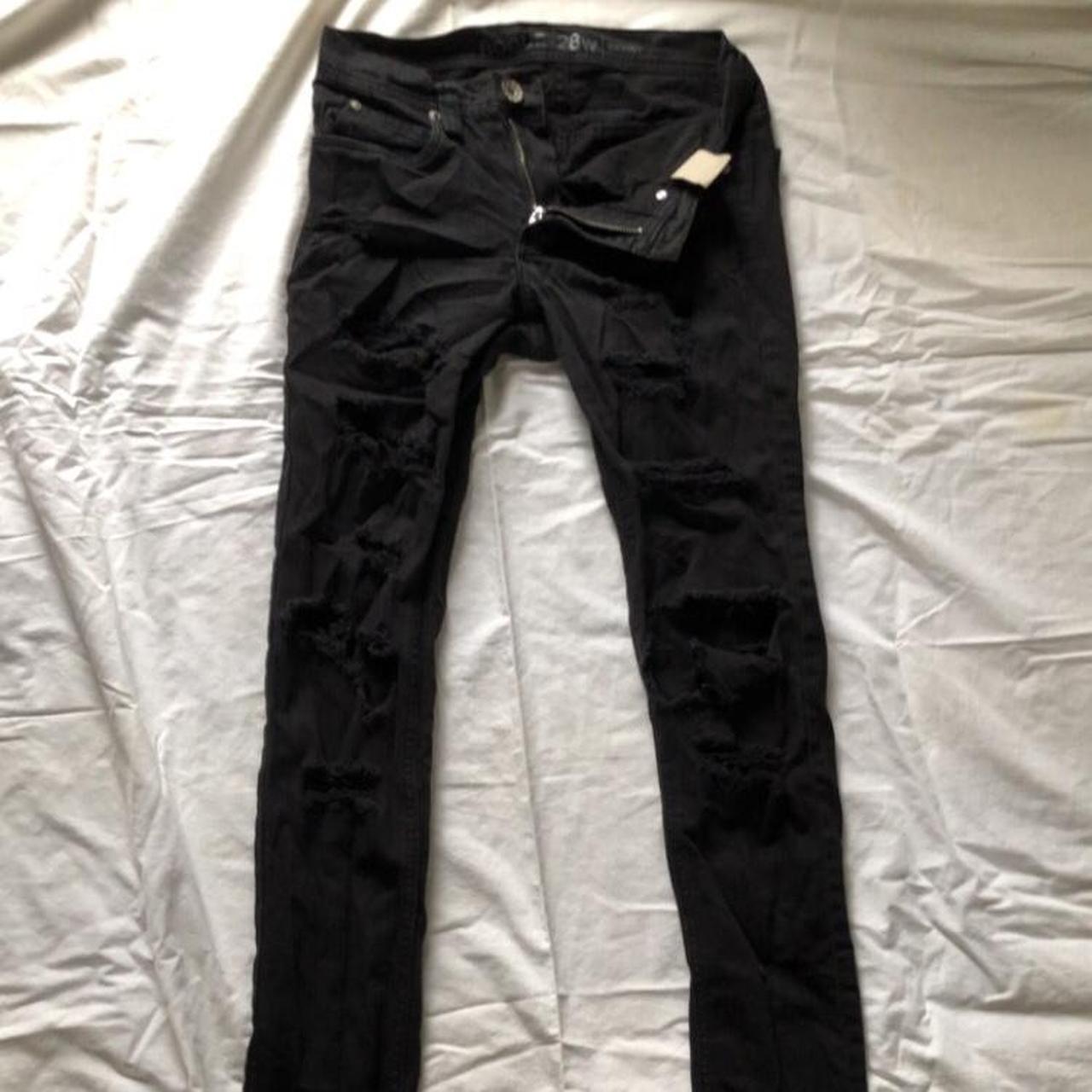 Rogue ripped black skinny jeans. Hole on left pant... - Depop