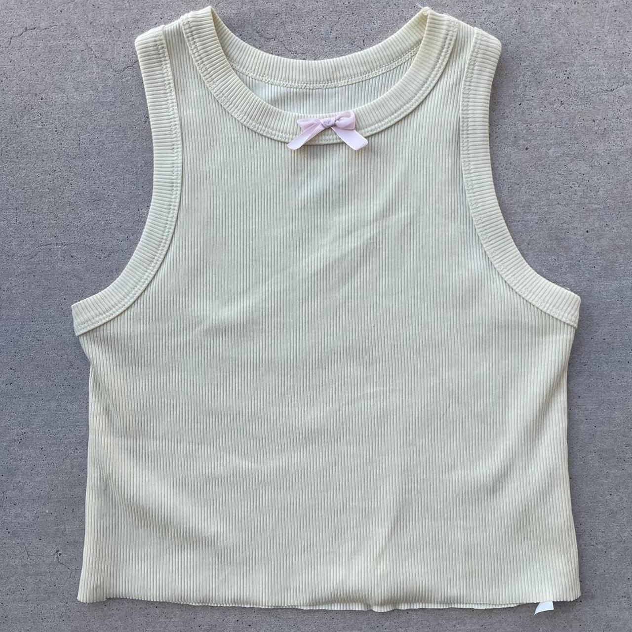 Pale yellow rubbed cropped tank with hand sewn light... - Depop