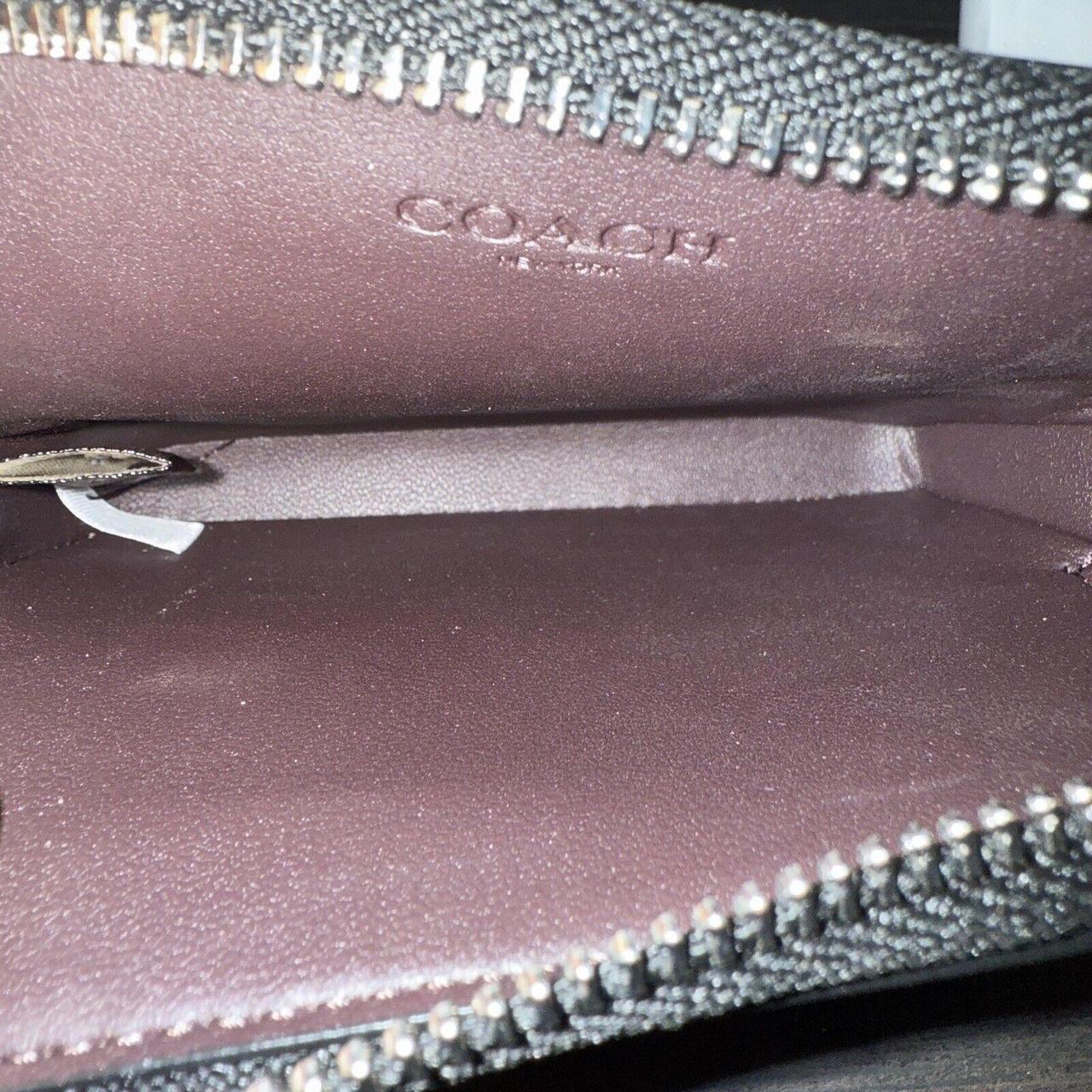 This COACH Zip Card Case Wallet features a unique... | Depop