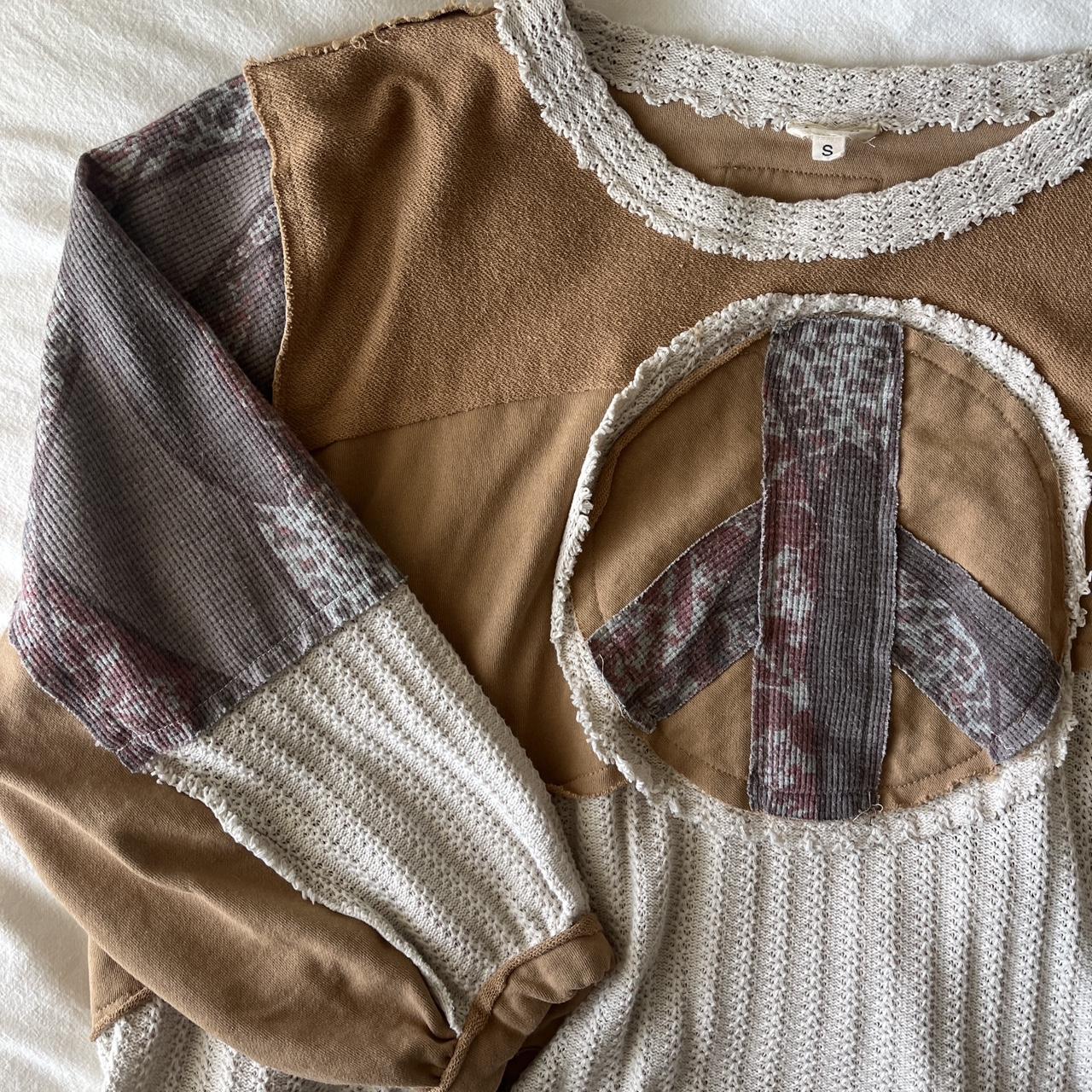 Brown and cream patchwork peace sign sweater. Looks... - Depop