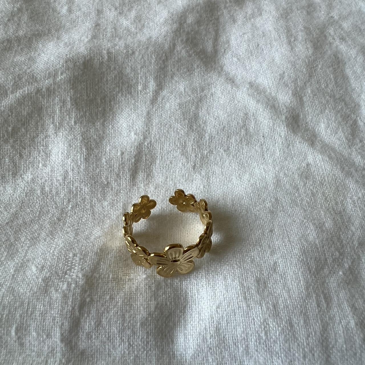 gold flower ring size: adjustable gold plated... - Depop