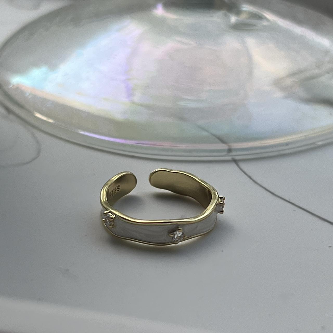 gold white marble ring with star accents size :... - Depop