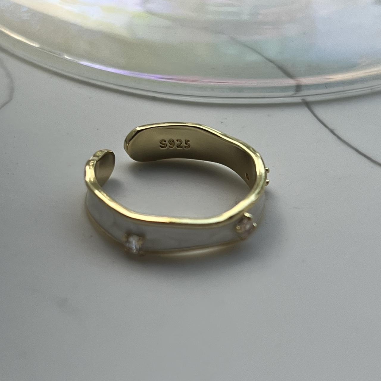 gold white marble ring with star accents size :... - Depop