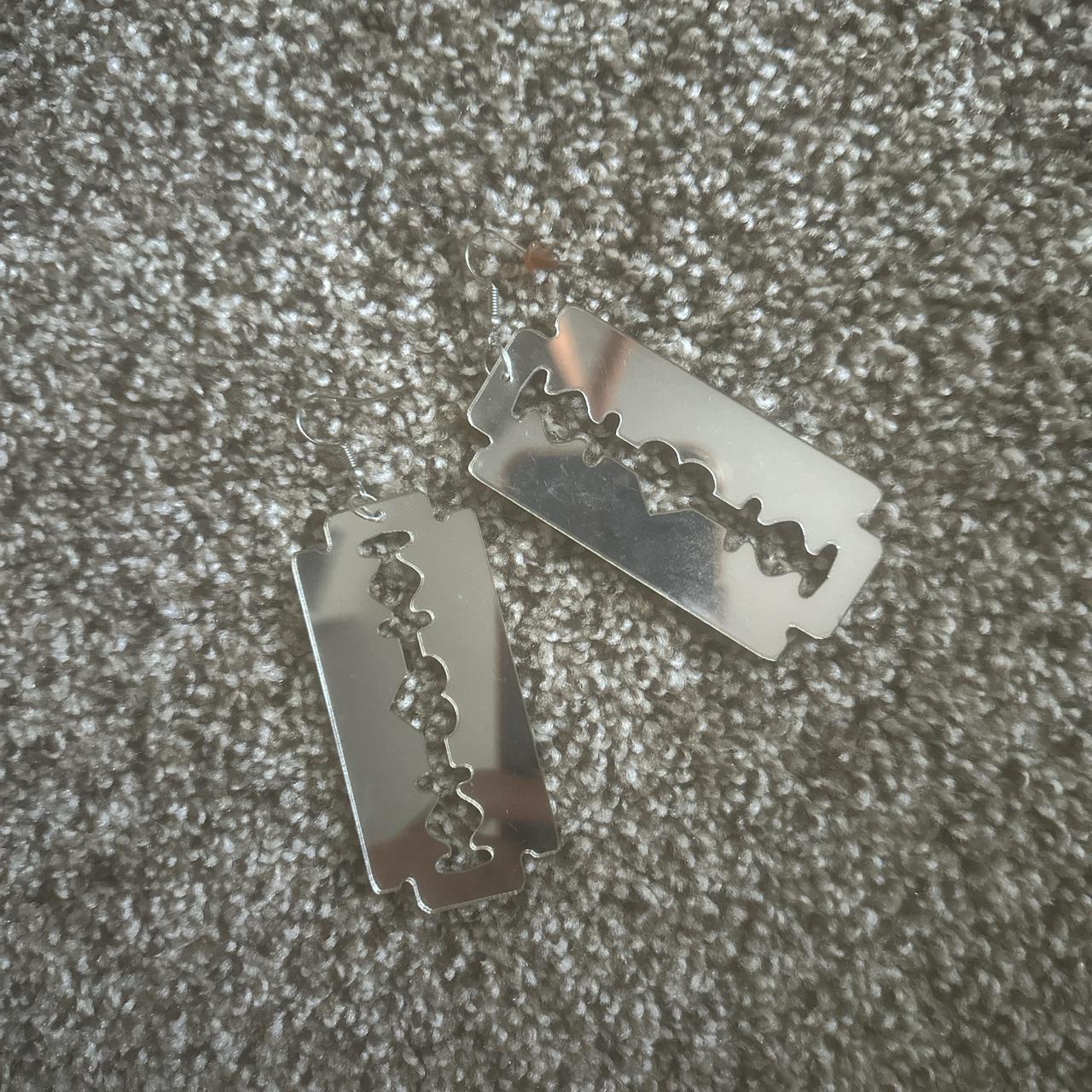 Oversized razor blade earrings, really shiny, heart... | Depop